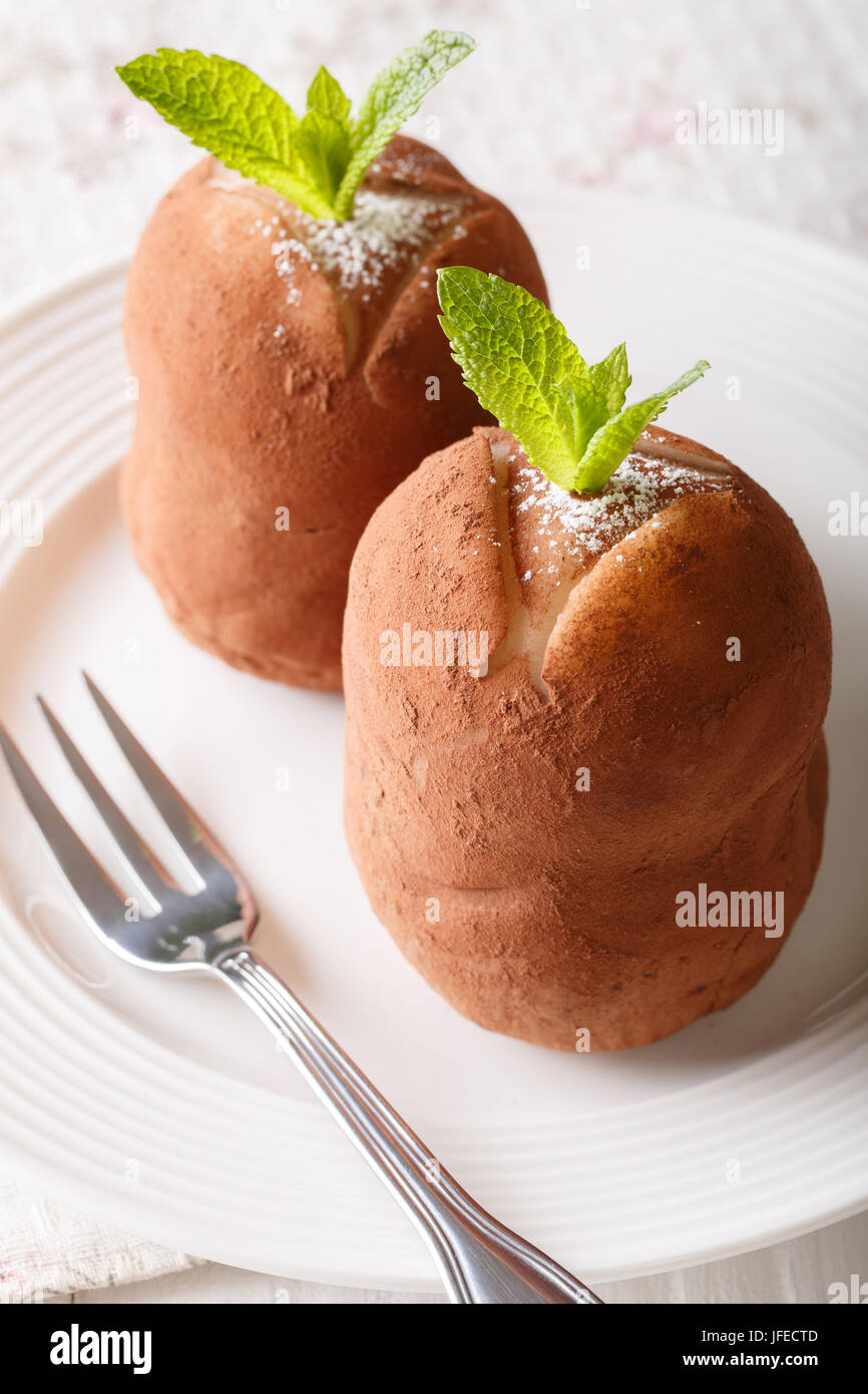 Traditional rum balls cake with mint and cocoa powder close-up on a ...