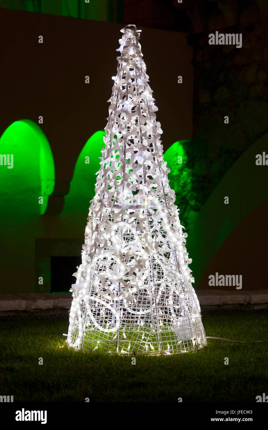 Outdoor Pine christmas tree figure with white lights Stock Photo - Alamy