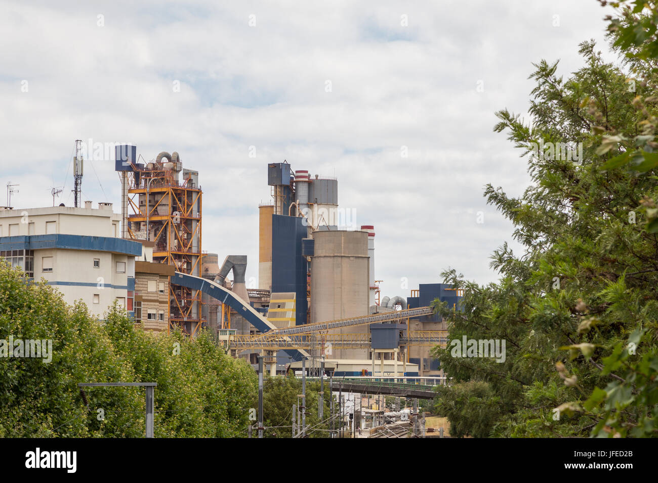 industrial building factory with structure and railroad Stock Photo - Alamy