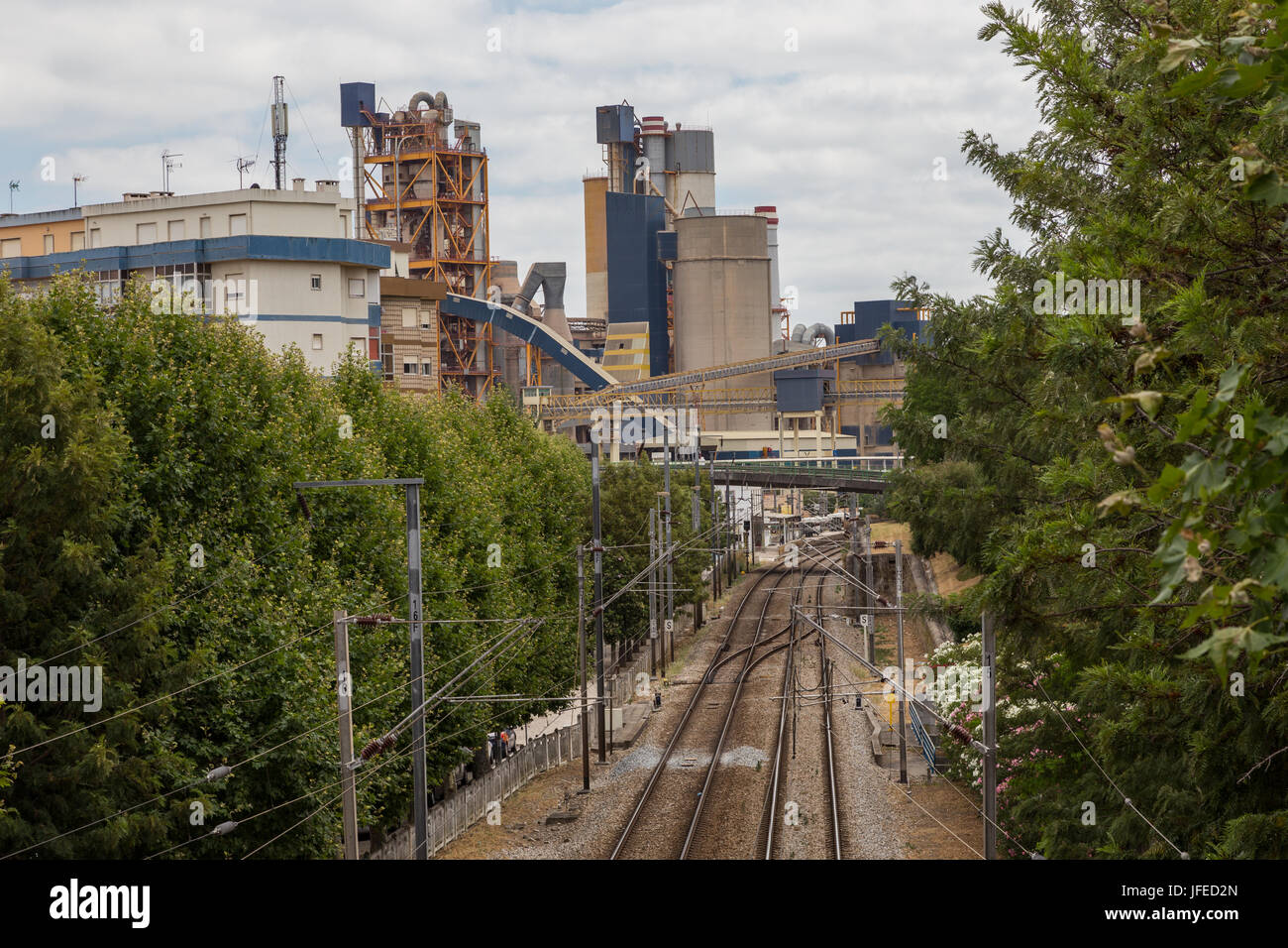 industrial building factory with structure and railroad Stock Photo - Alamy