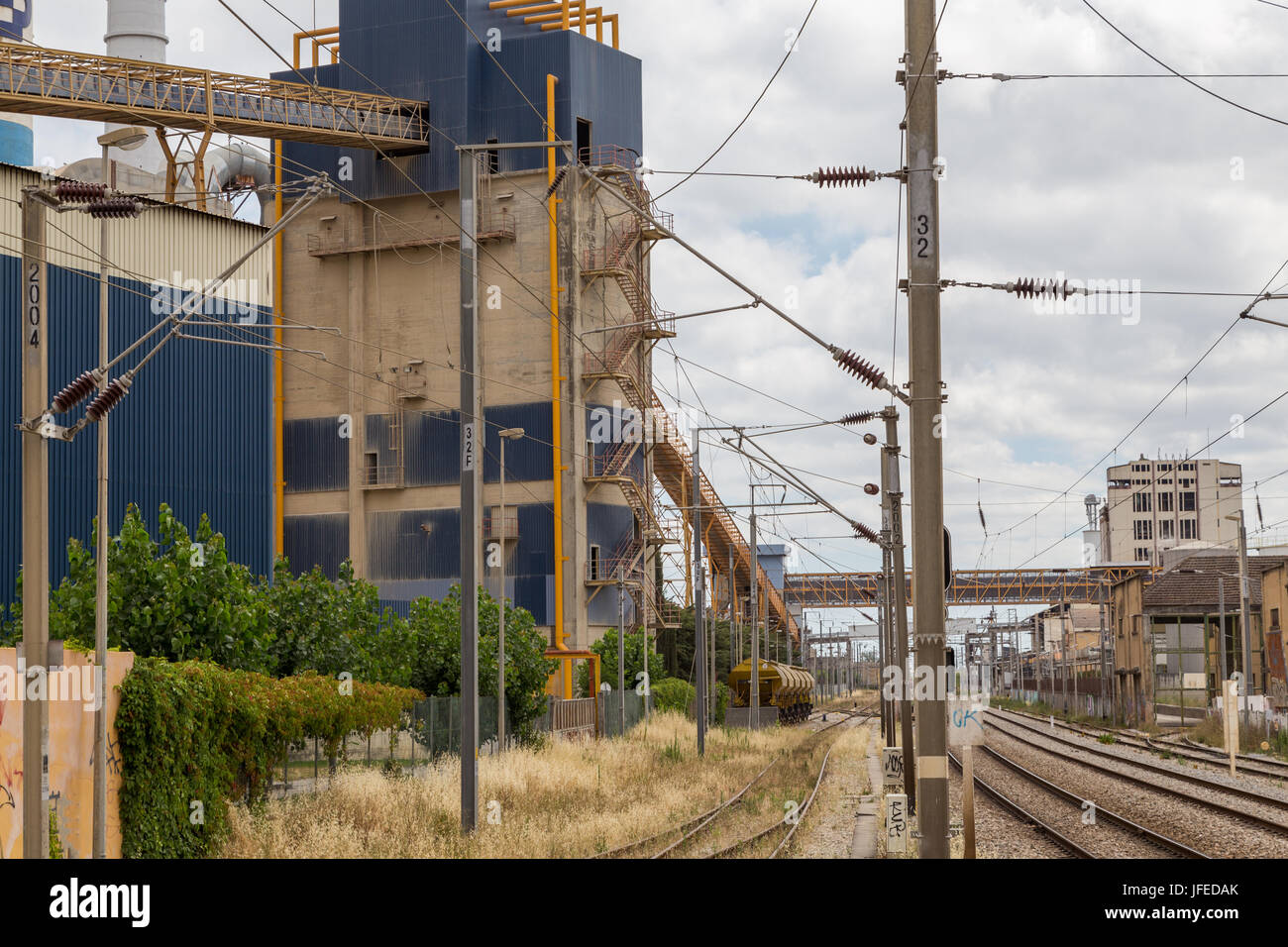 industrial building factory with structure and railroad Stock Photo - Alamy