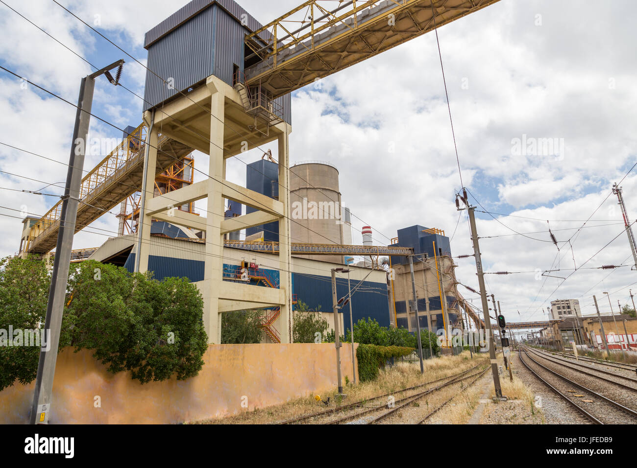 industrial building factory with structure and railroad Stock Photo - Alamy