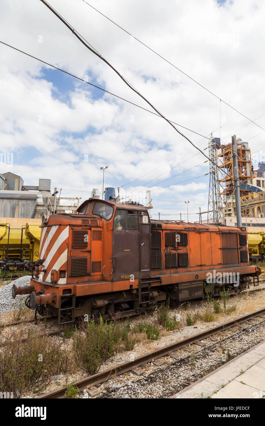 heavy train wagon with industrial building factory Stock Photo - Alamy