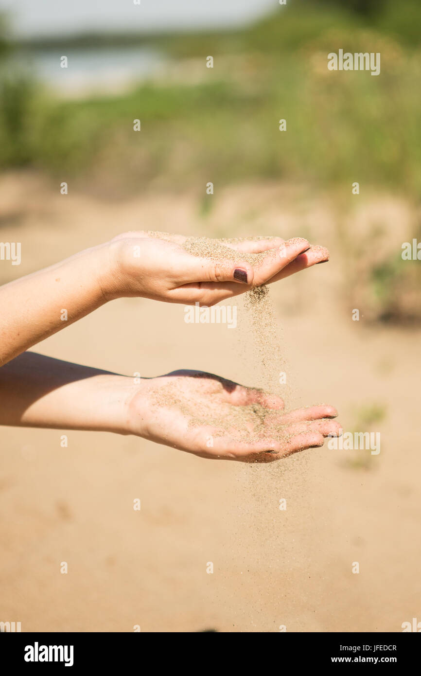 Hands holding pouring sand hi-res stock photography and images - Alamy