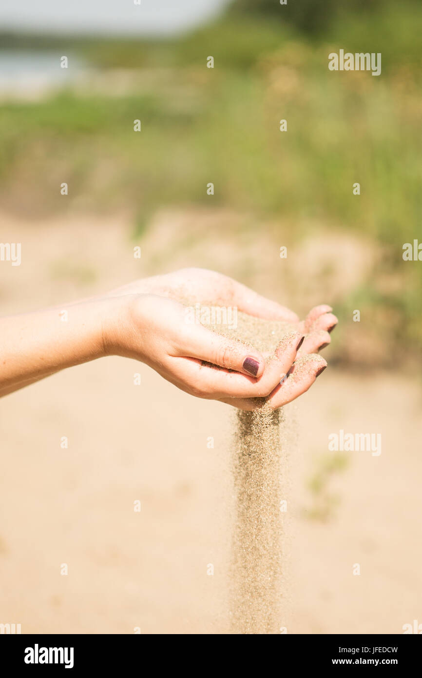 Hands holding pouring sand hi-res stock photography and images - Alamy