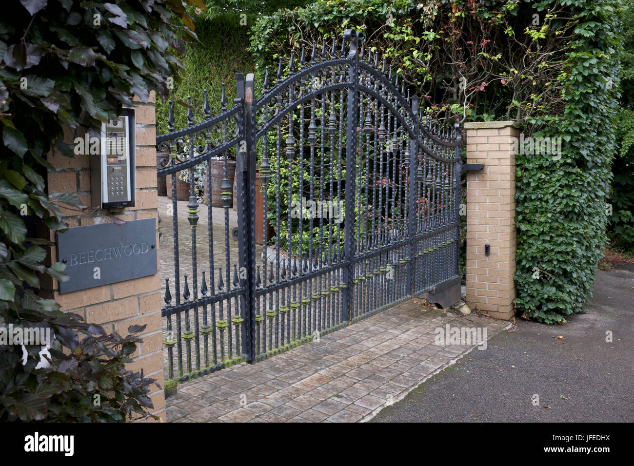 A strong gate and and communication unit out side a house Stock Photo ...