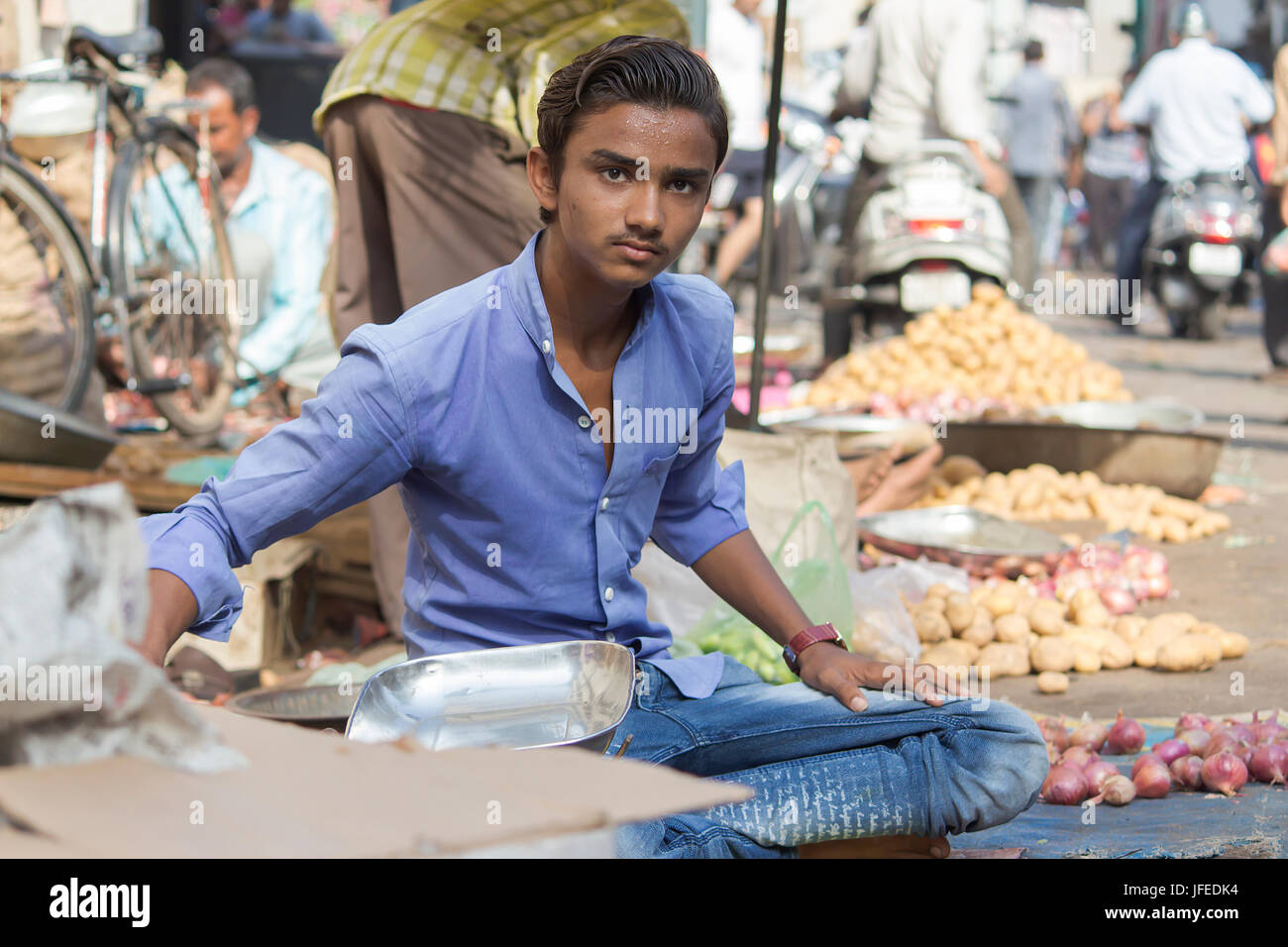 A boy selling vegetables in the streets of khadia at manek chowk Stock ...