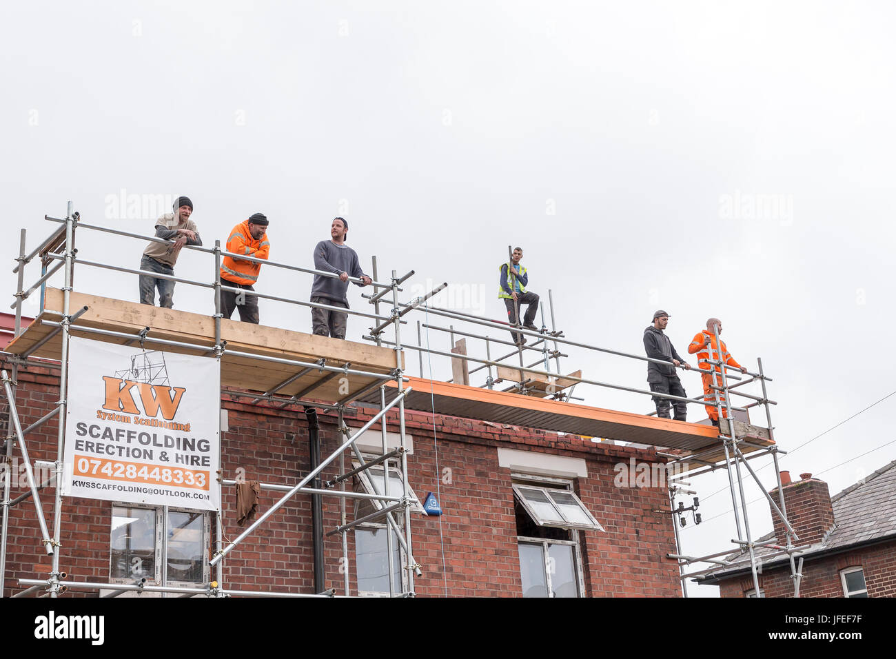 Workers resting on roof hi-res stock photography and images - Alamy