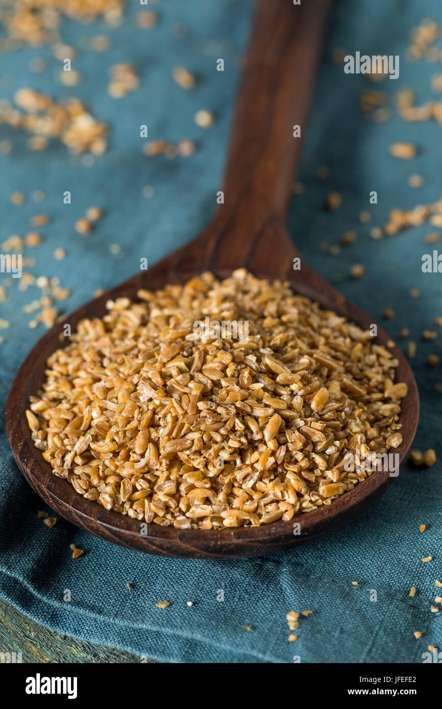 Raw Organic Brown Bulgar Wheat in a Spoon Stock Photo - Alamy