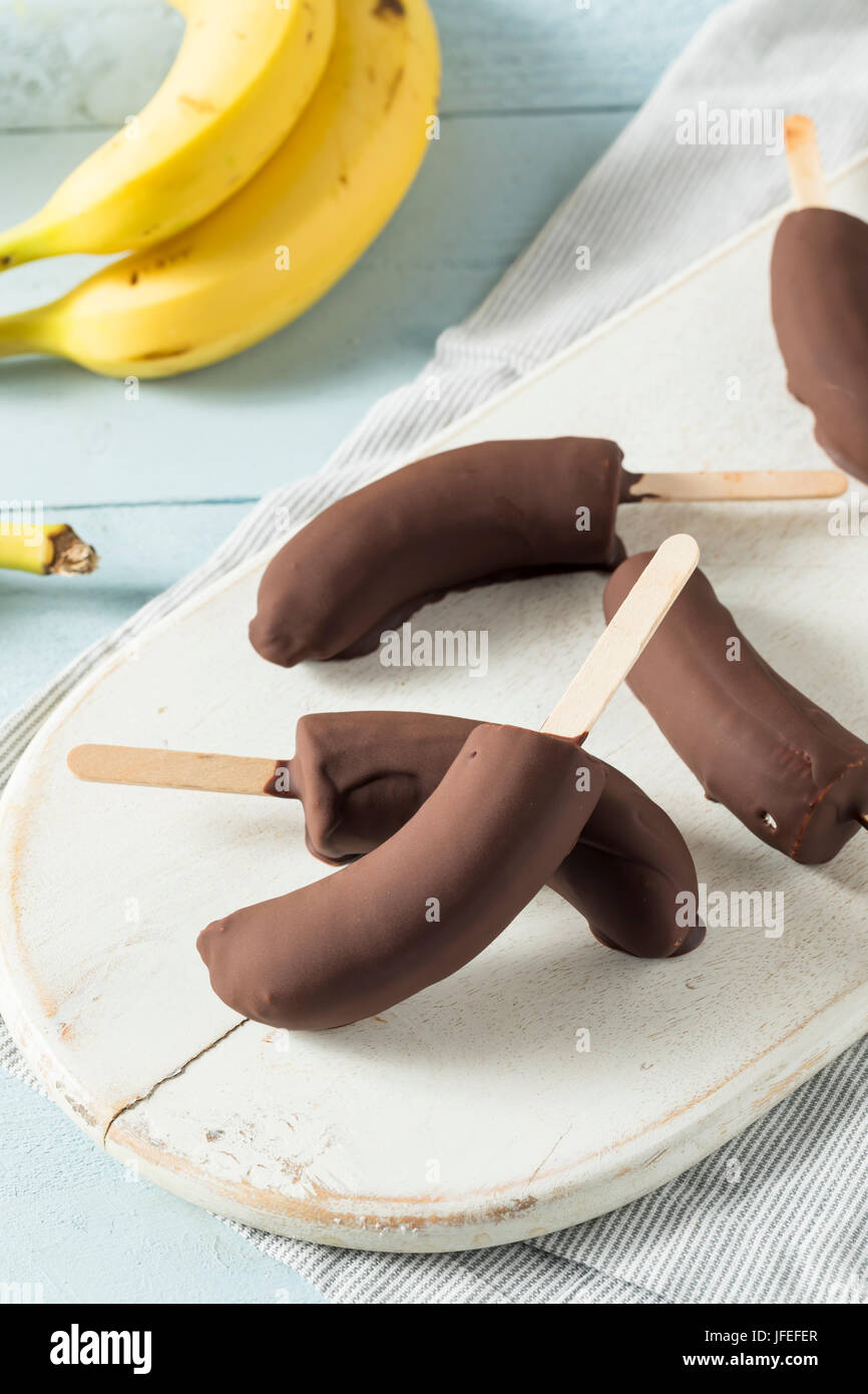 Homemade Frozen Chocolate Covered Bananas on a Stick Stock Photo - Alamy