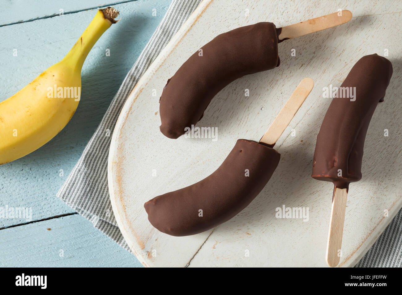 Homemade Frozen Chocolate Covered Bananas on a Stick Stock Photo - Alamy