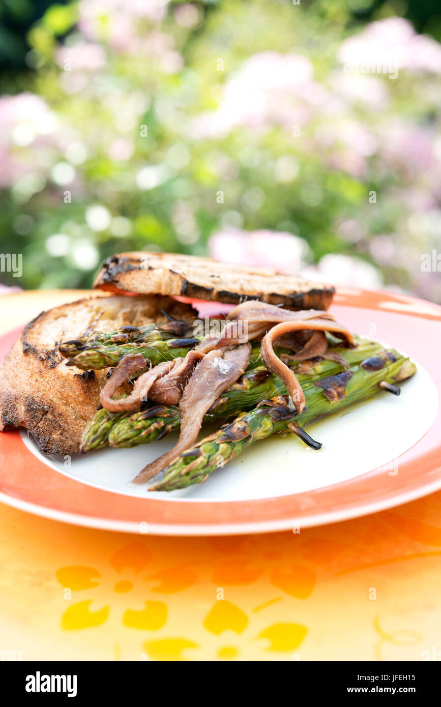 Asparagus, grilled, anchovies, bread Stock Photo - Alamy