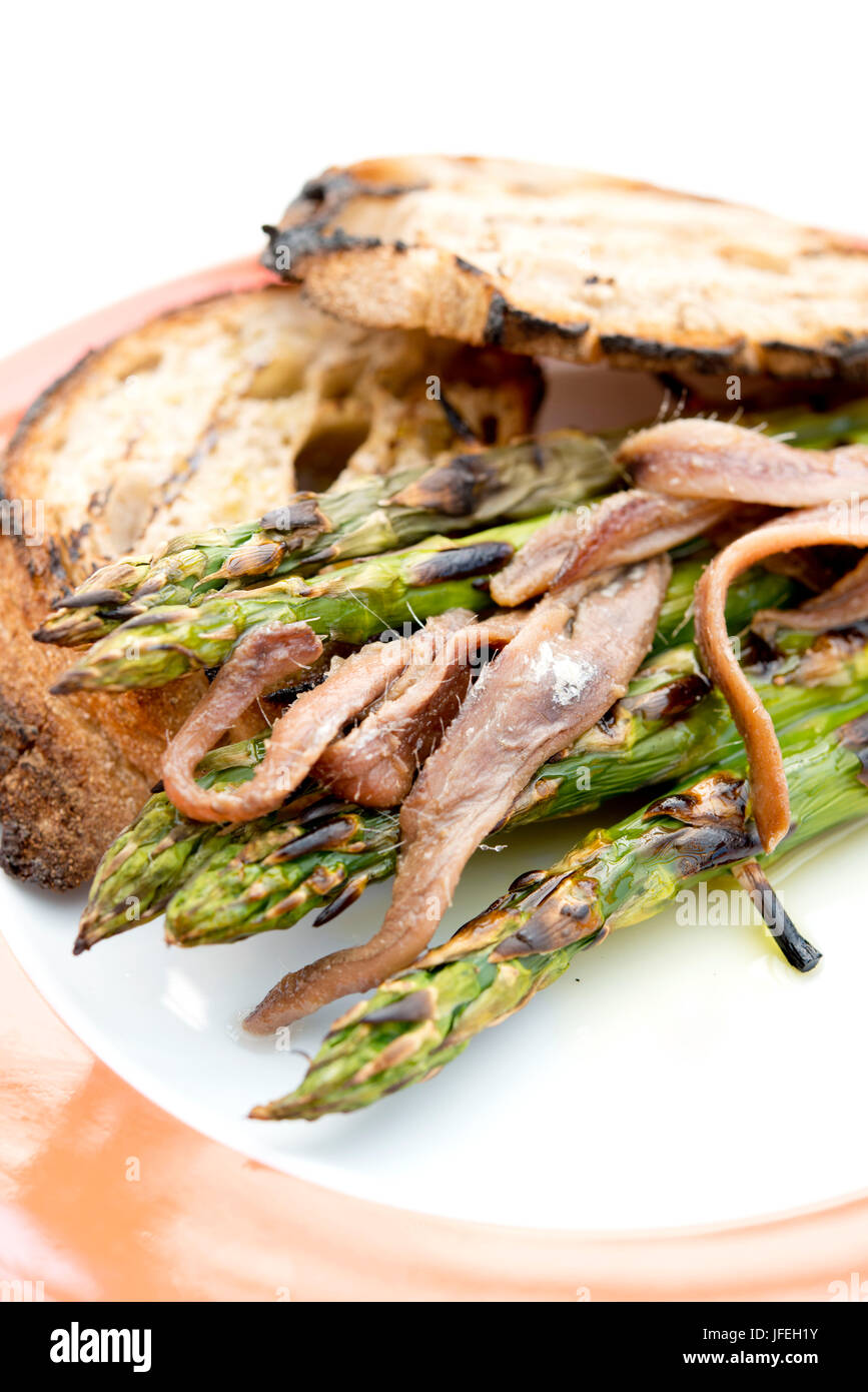 Asparagus, grilled, anchovies, bread Stock Photo - Alamy