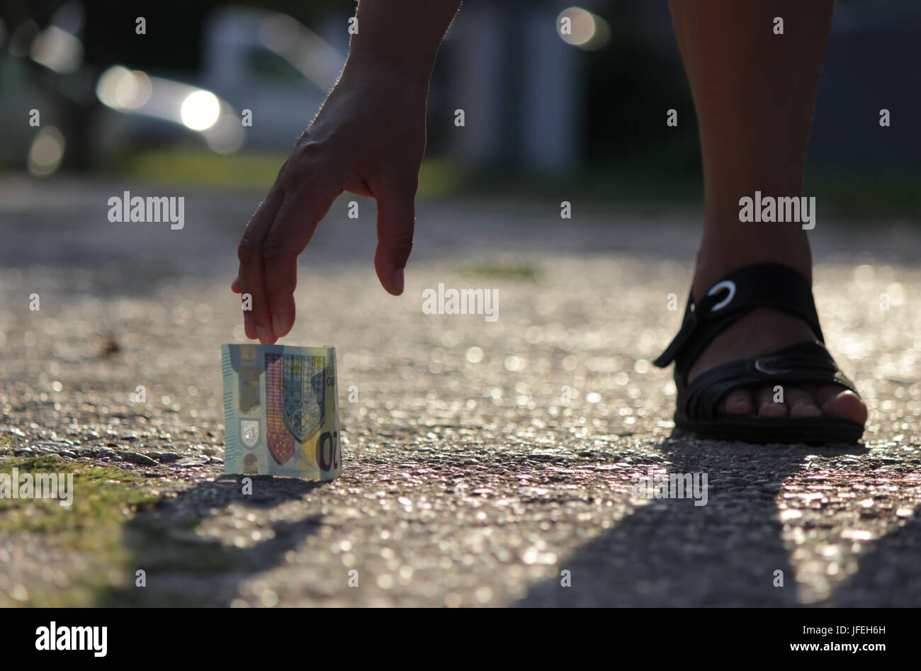 Woman catching money hi-res stock photography and images - Alamy