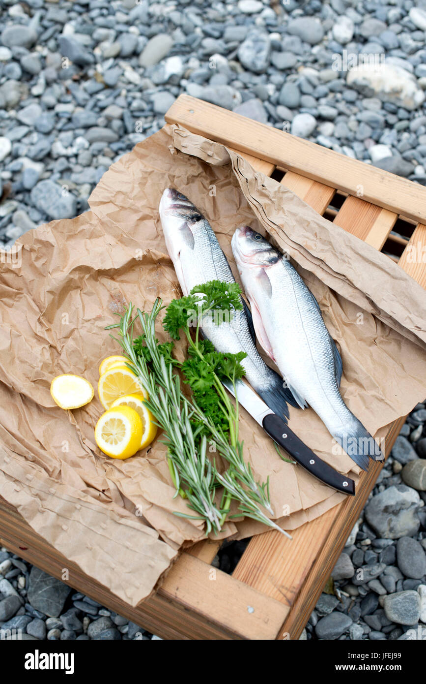 Fish, branzino, grill box Stock Photo - Alamy