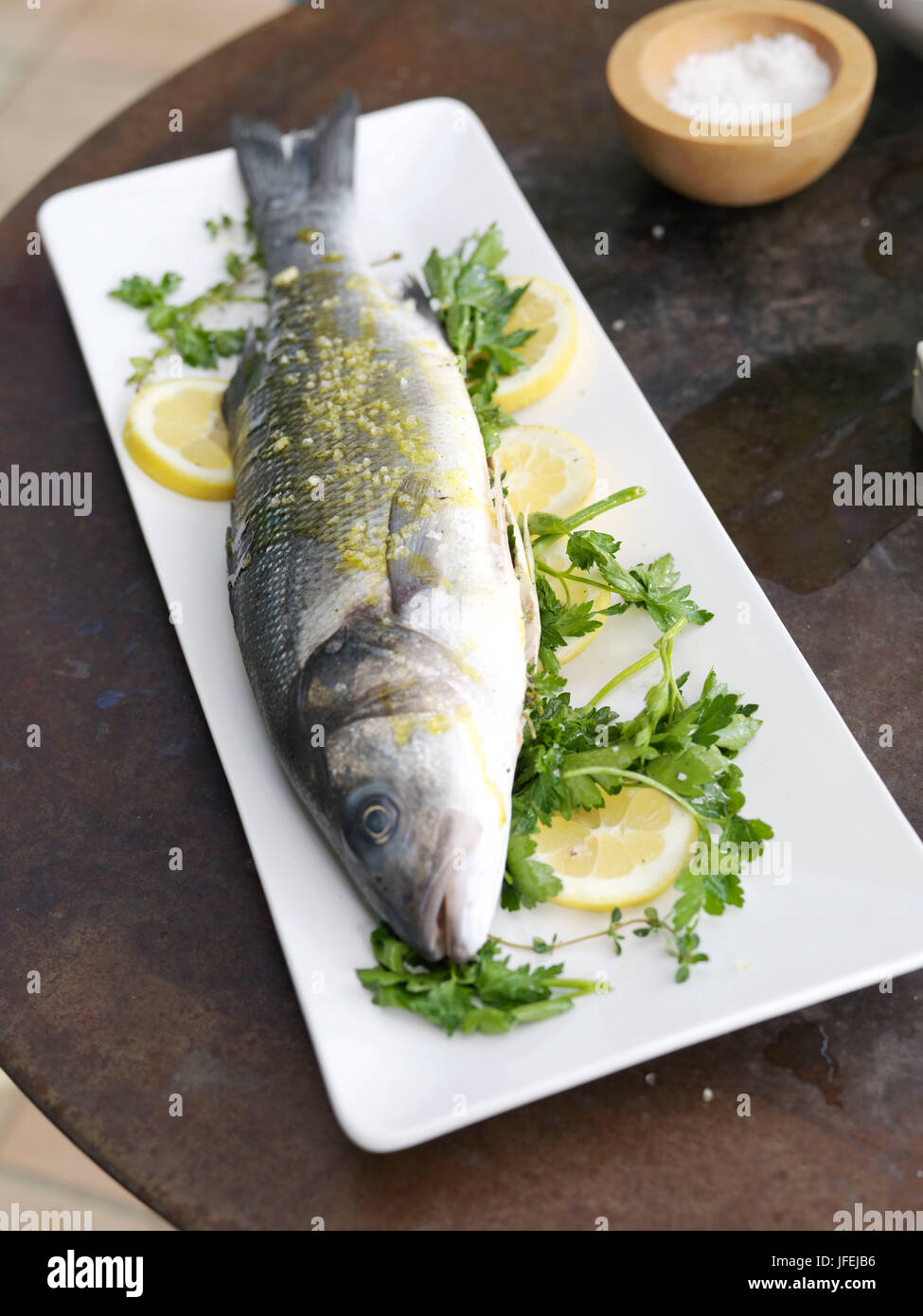 Fish, branzino or European sea bass, raw, spicy Stock Photo - Alamy