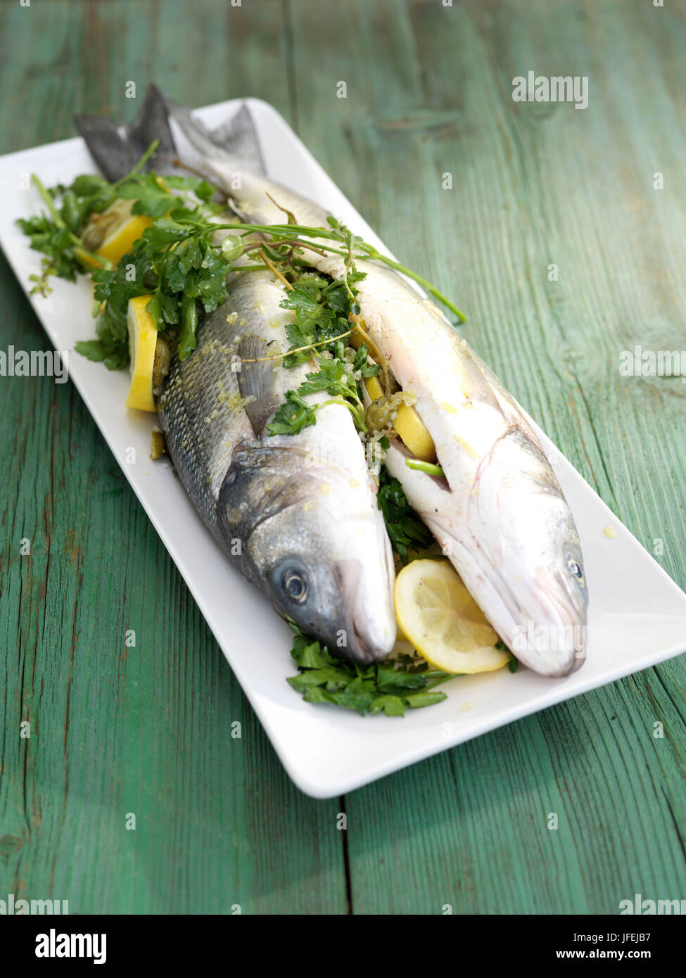 Raw sea bass stuffed hi-res stock photography and images - Alamy