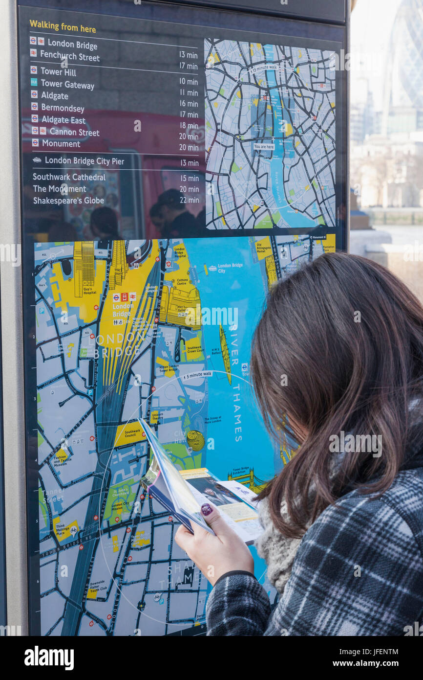 England, London, Visitor Looking at Street Map of London Bridge Station ...