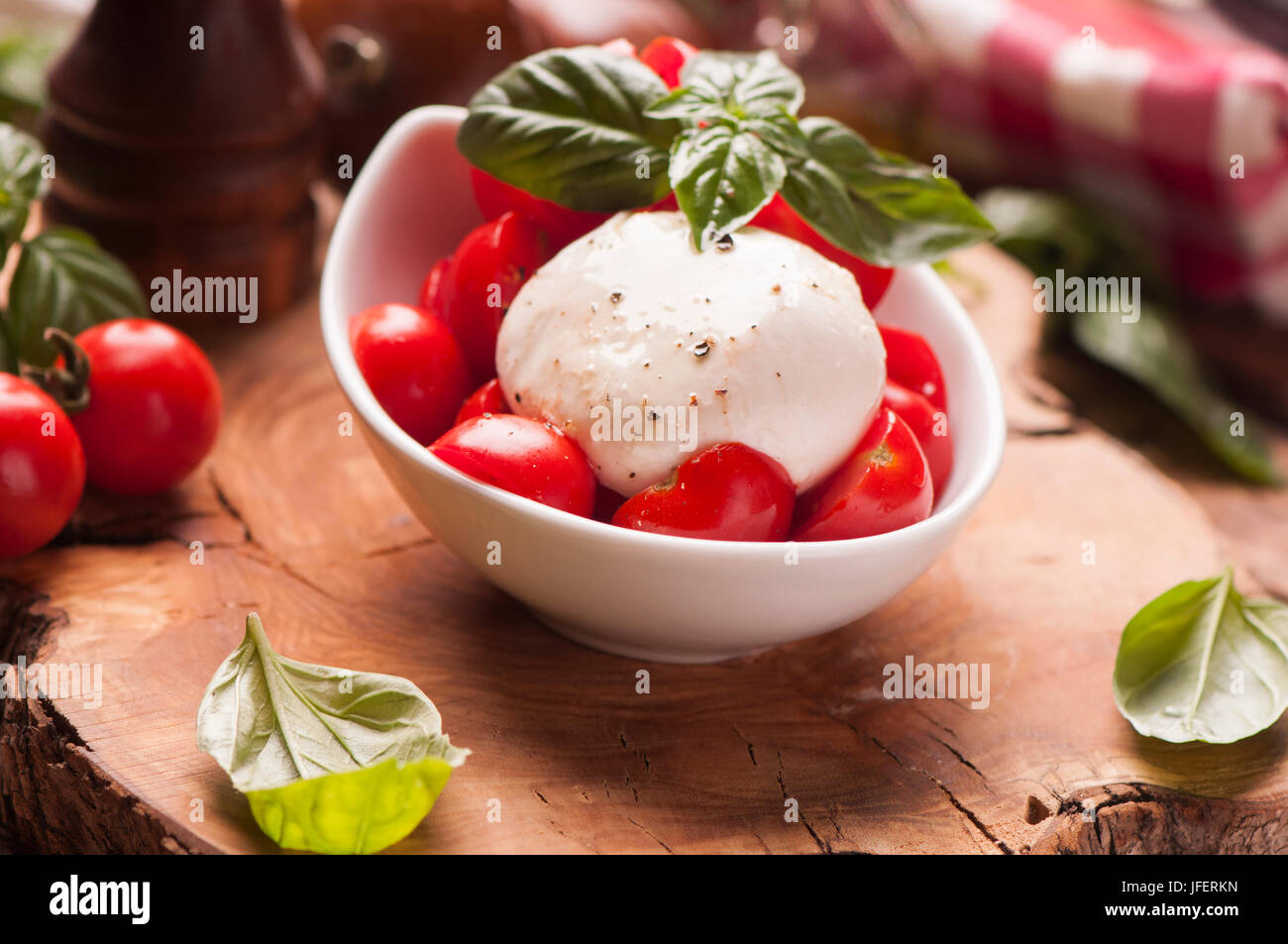 Caprese salad with baby mozzarella cheese Stock Photo - Alamy