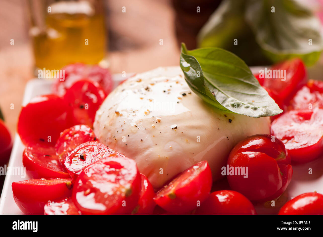 Caprese salad with baby mozzarella cheese Stock Photo - Alamy
