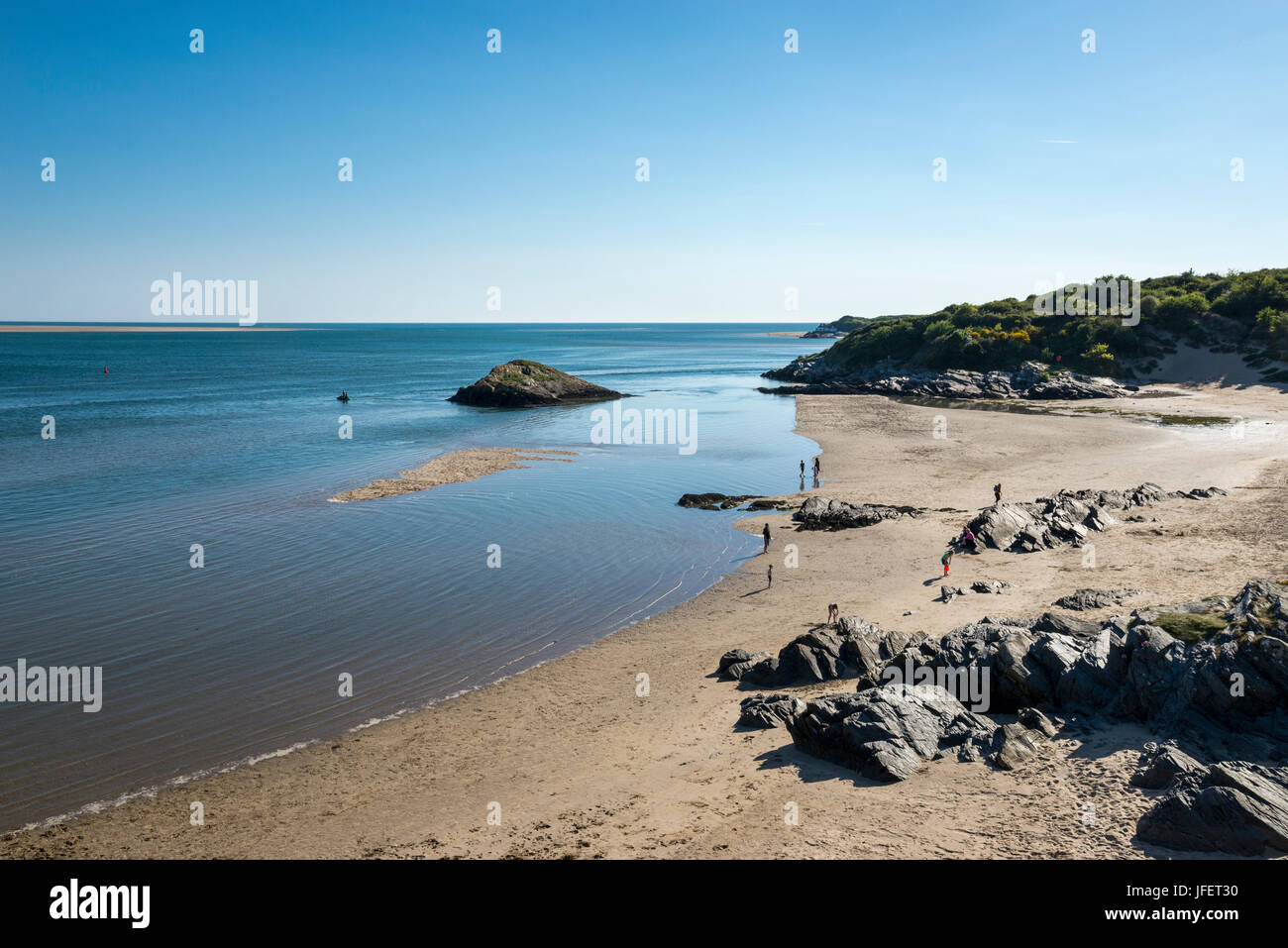 People enjoying the beach at Borth y Gest near Porthmadog, Wales on a ...