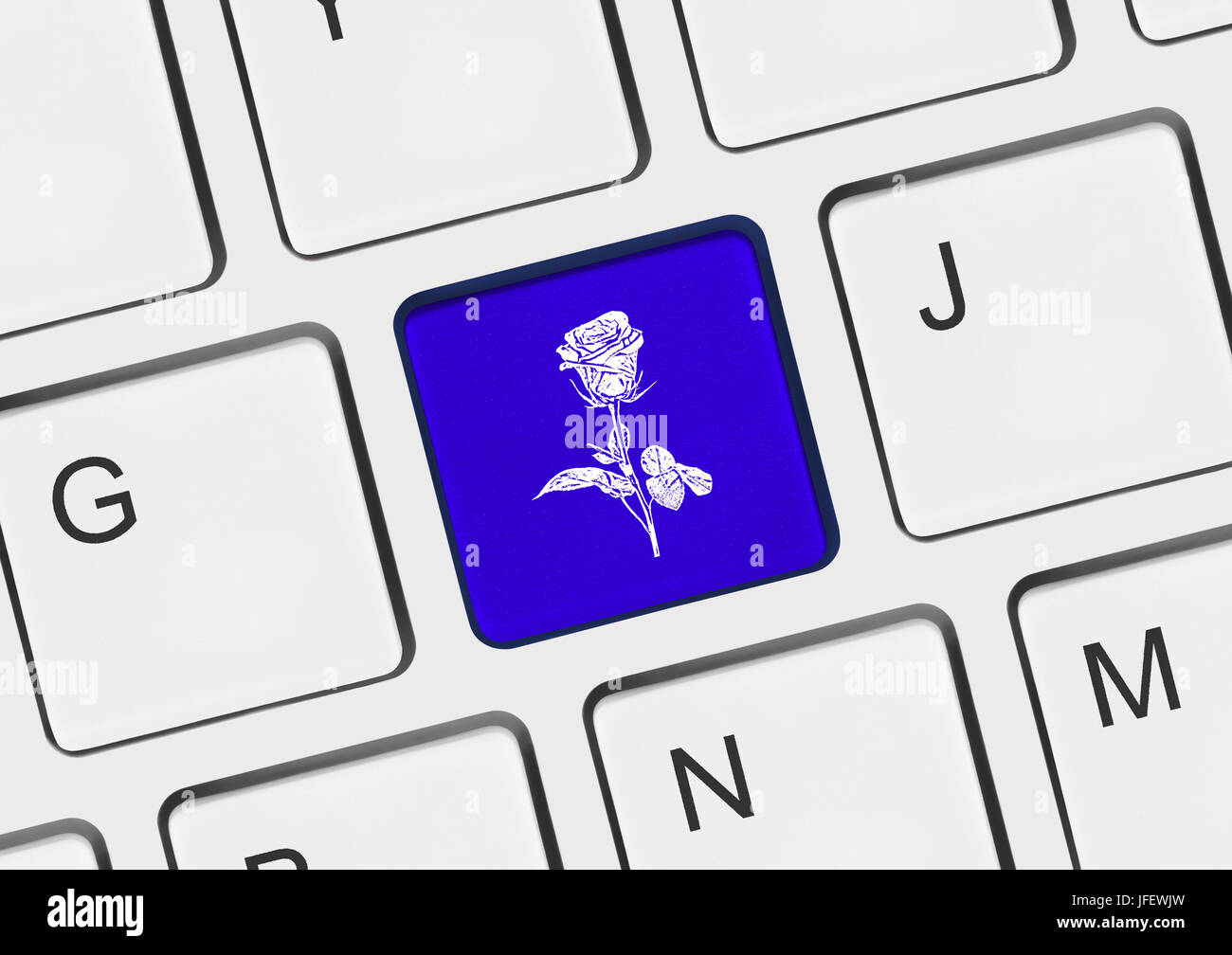 Computer keyboard with flower key Stock Photo - Alamy