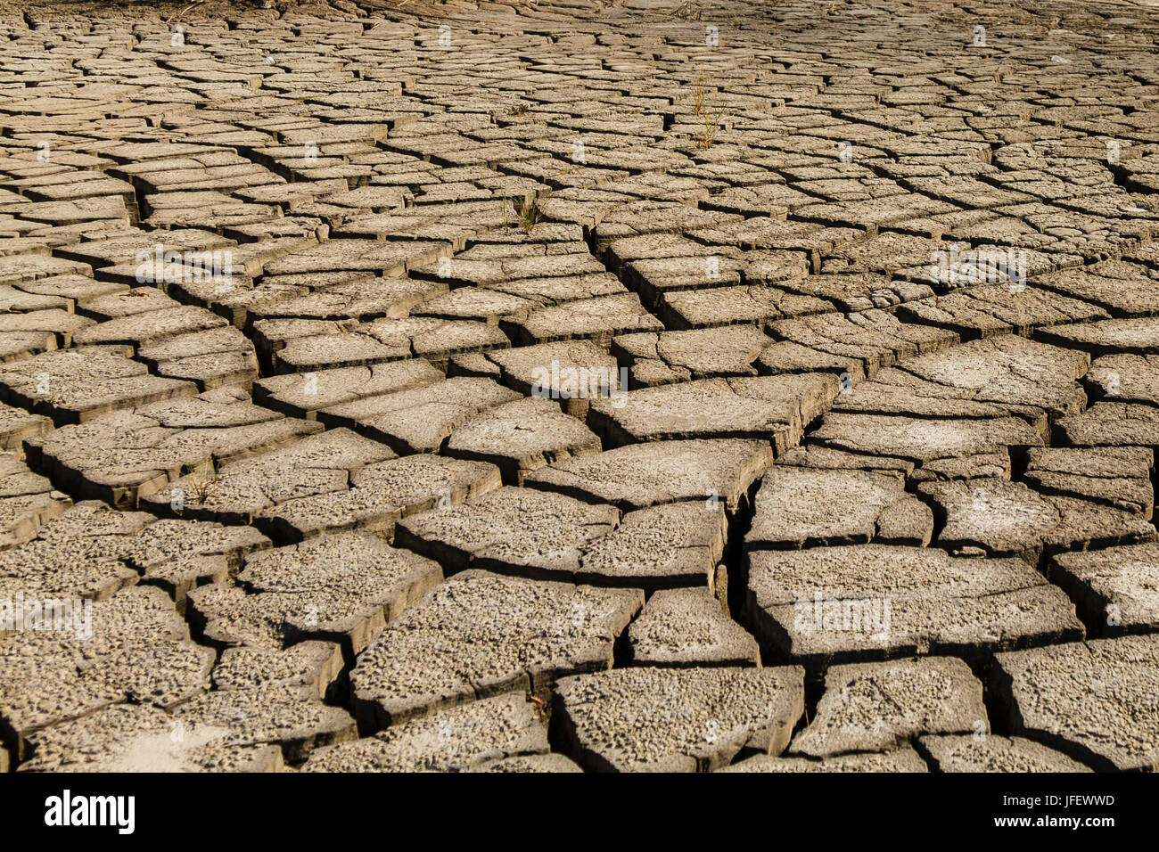 Dry cracked sand flats during drought Stock Photo - Alamy