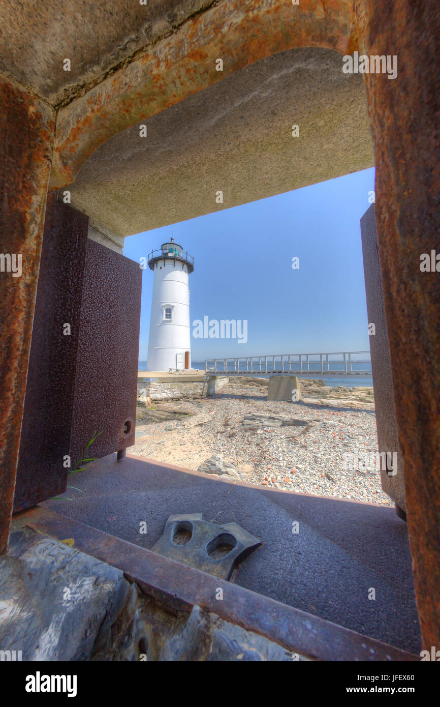 View of Portsmouth Harbor Lighthouse through the ruins of a gun turret ...