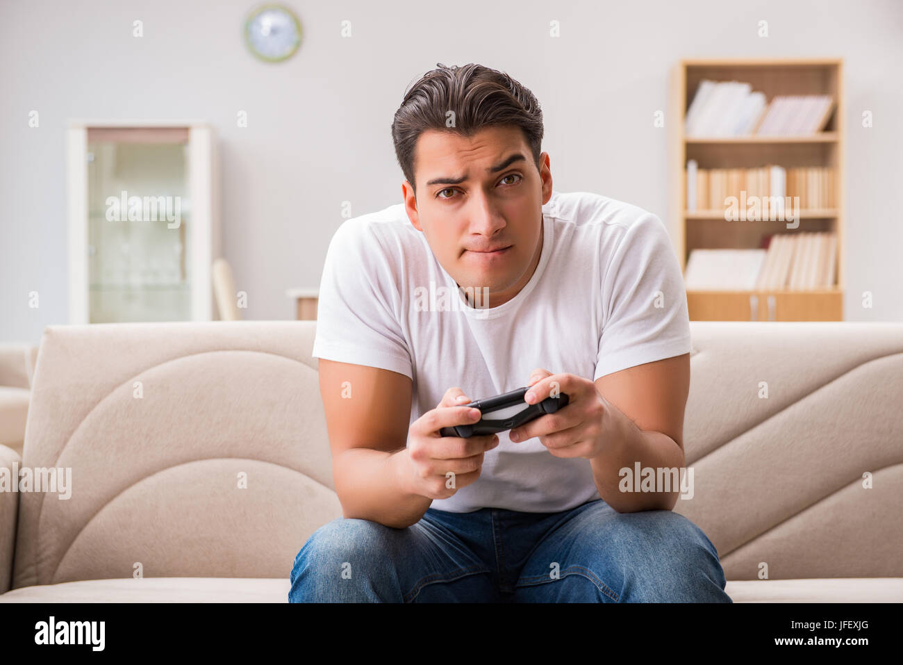 Man addicted to computer games Stock Photo - Alamy
