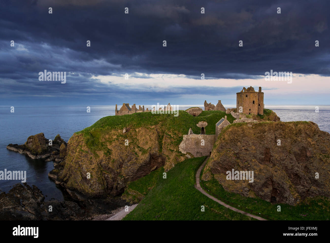 Menacing dark clouds above Dunnottar Castle, ruined medieval fortress ...