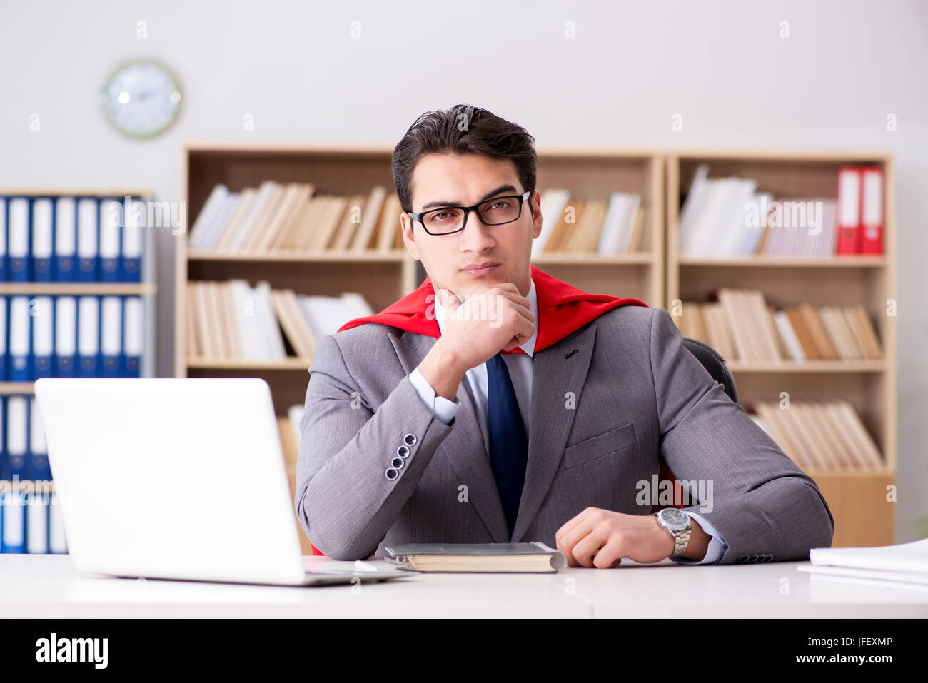 Superhero businessman working in the office Stock Photo - Alamy