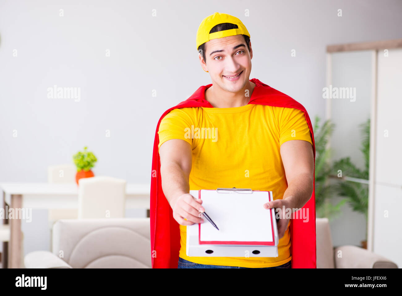 Superhero pizza delivery guy with red cover Stock Photo - Alamy