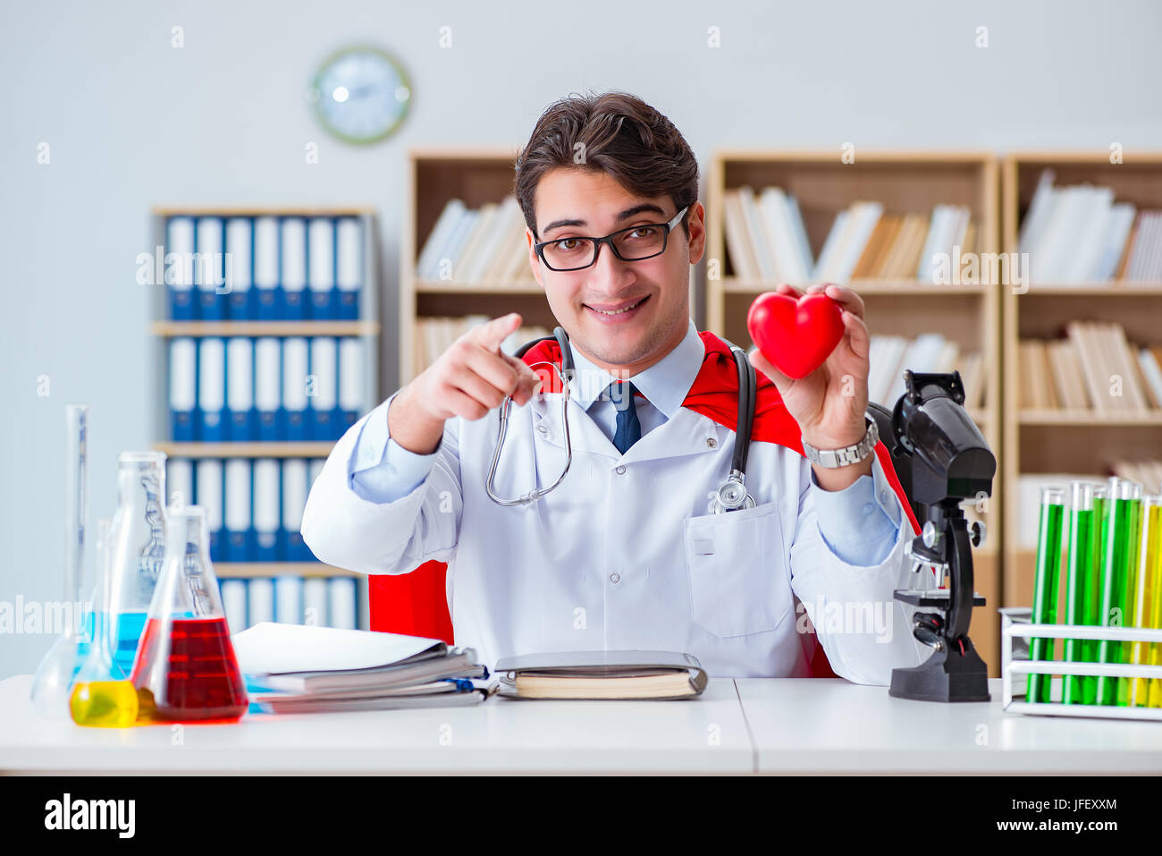 Superhero doctor working in the hospital lab Stock Photo - Alamy