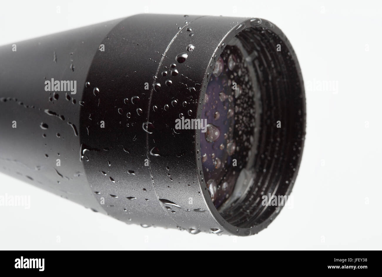 Objective lens on a rifle scope covered in water Stock Photo - Alamy