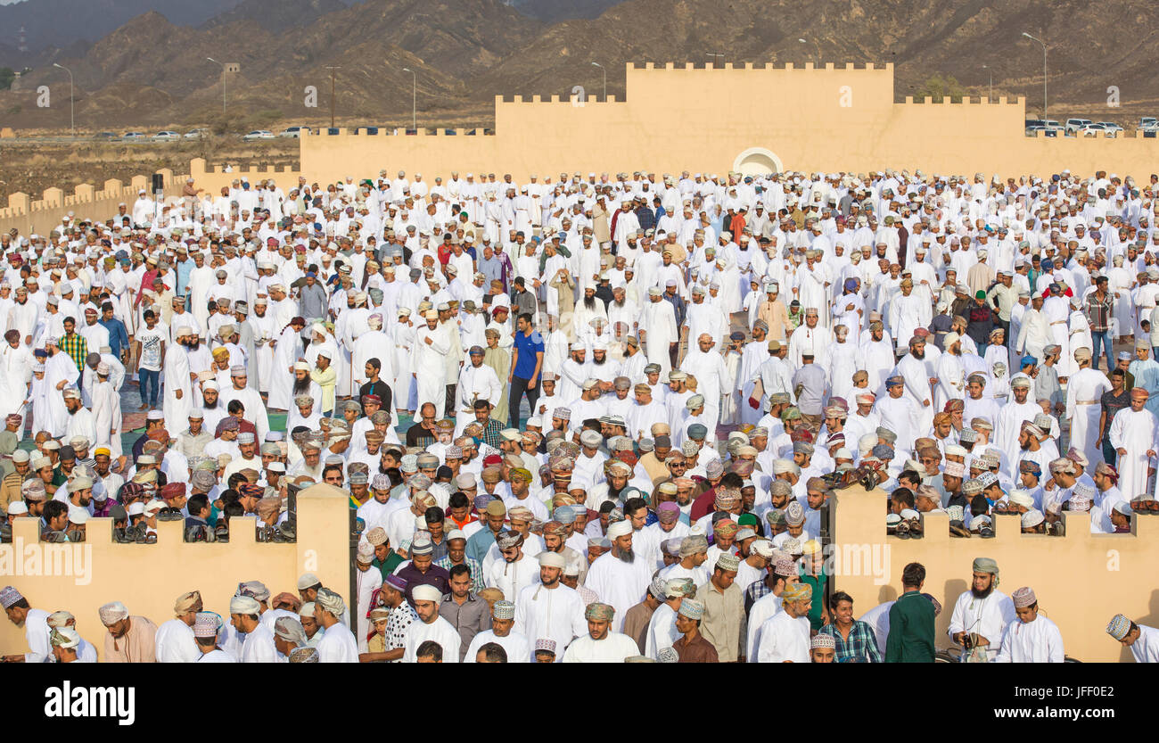 Nizwa, Oman - June 26th 2017: omani people in traditional clothing at a ...