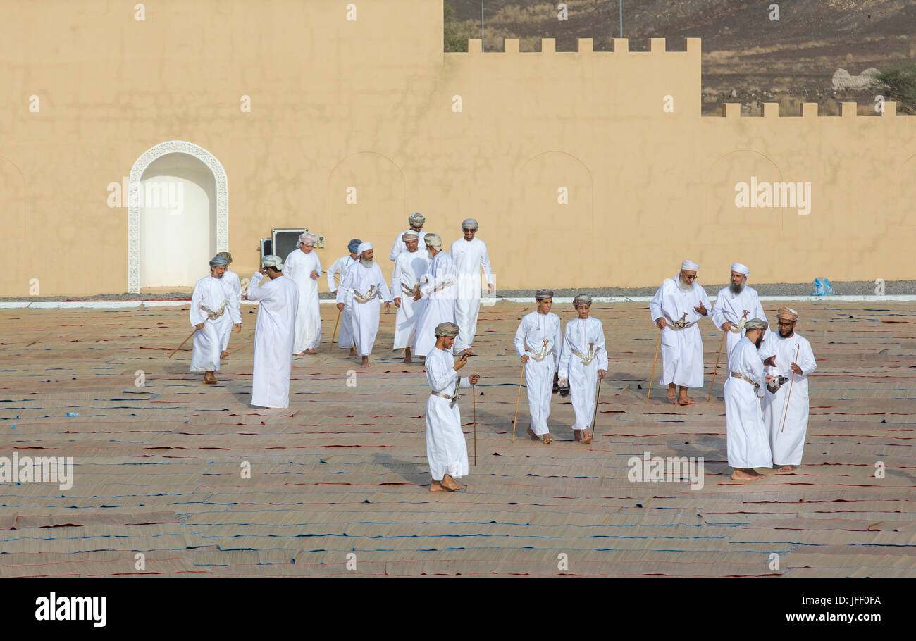 Nizwa, Oman - June 26th 2017: omani people in traditional clothing at a ...