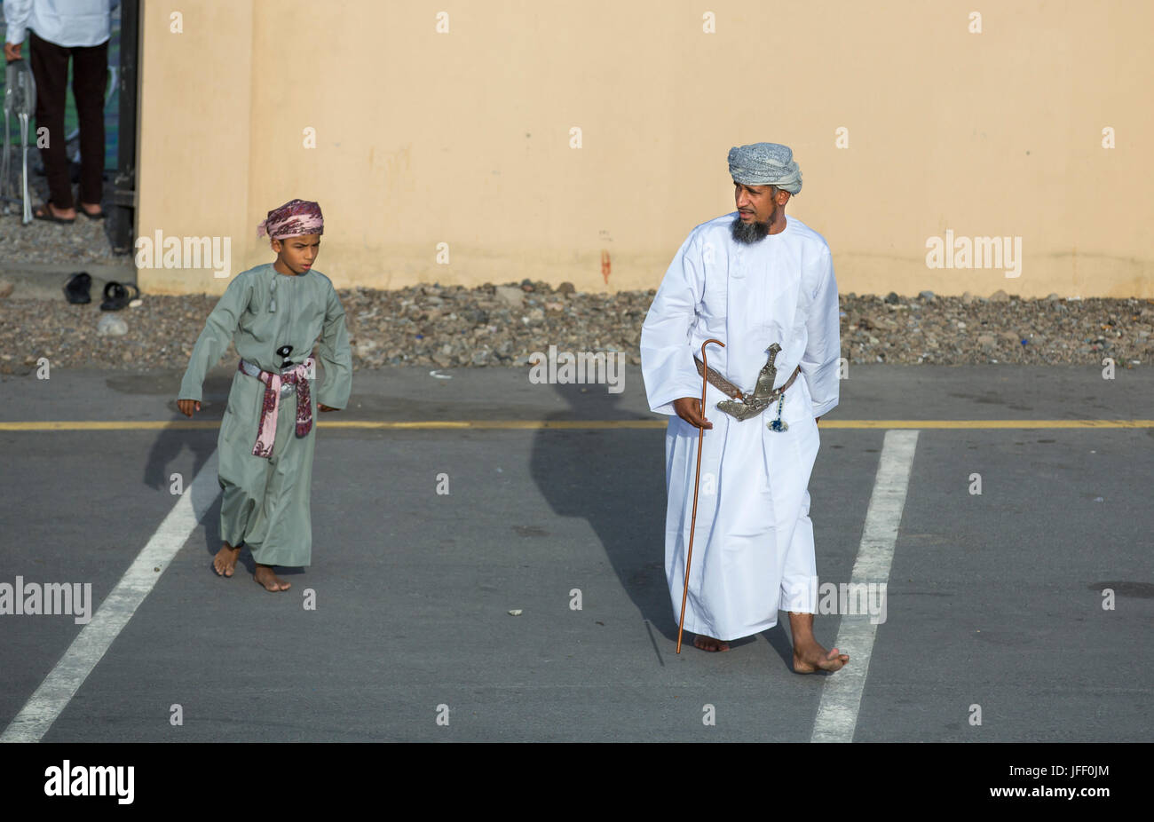Nizwa, Oman - June 26th 2017: omani people in traditional clothing at a ...