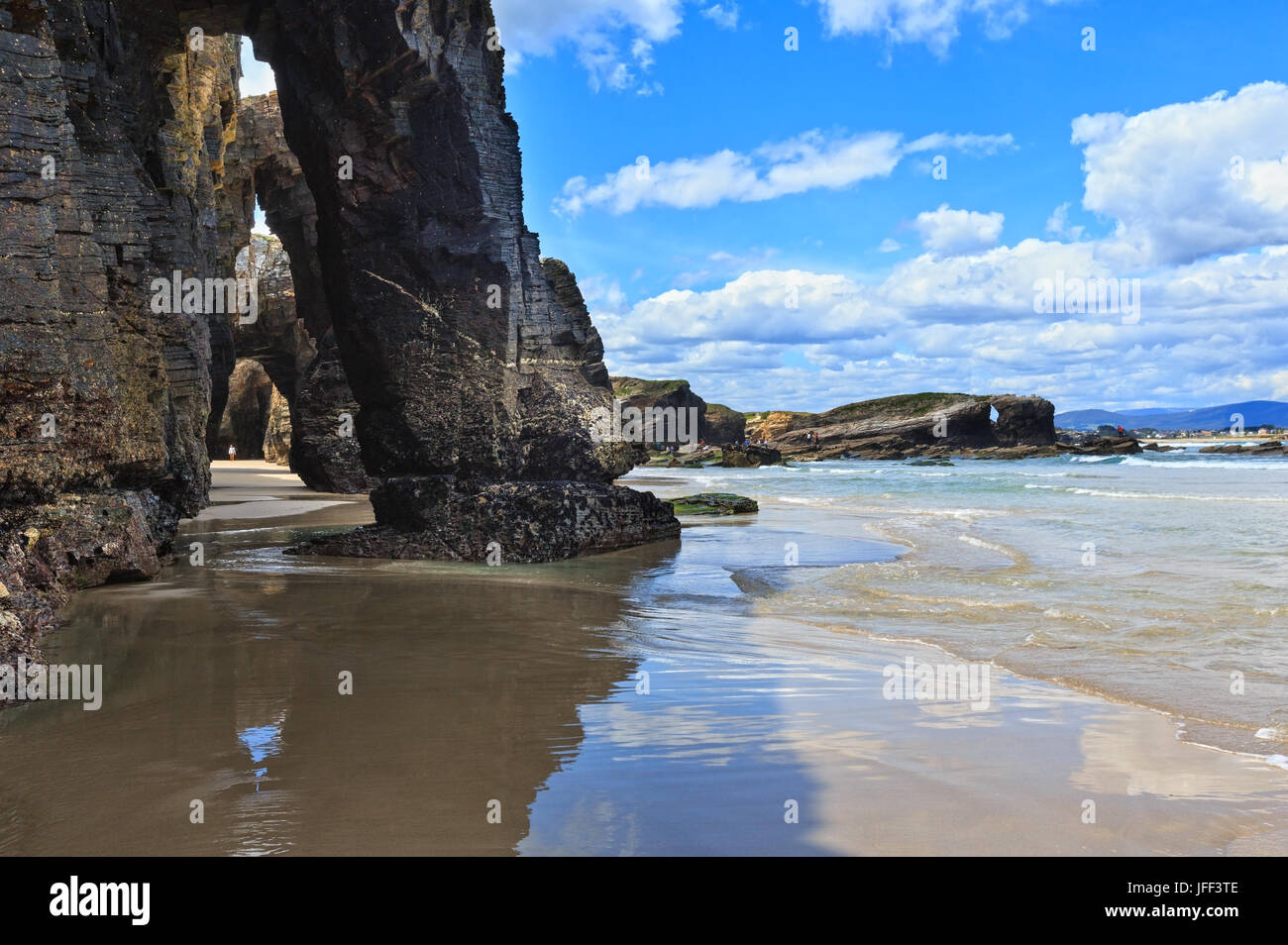 Natural arches on beach Stock Photo - Alamy