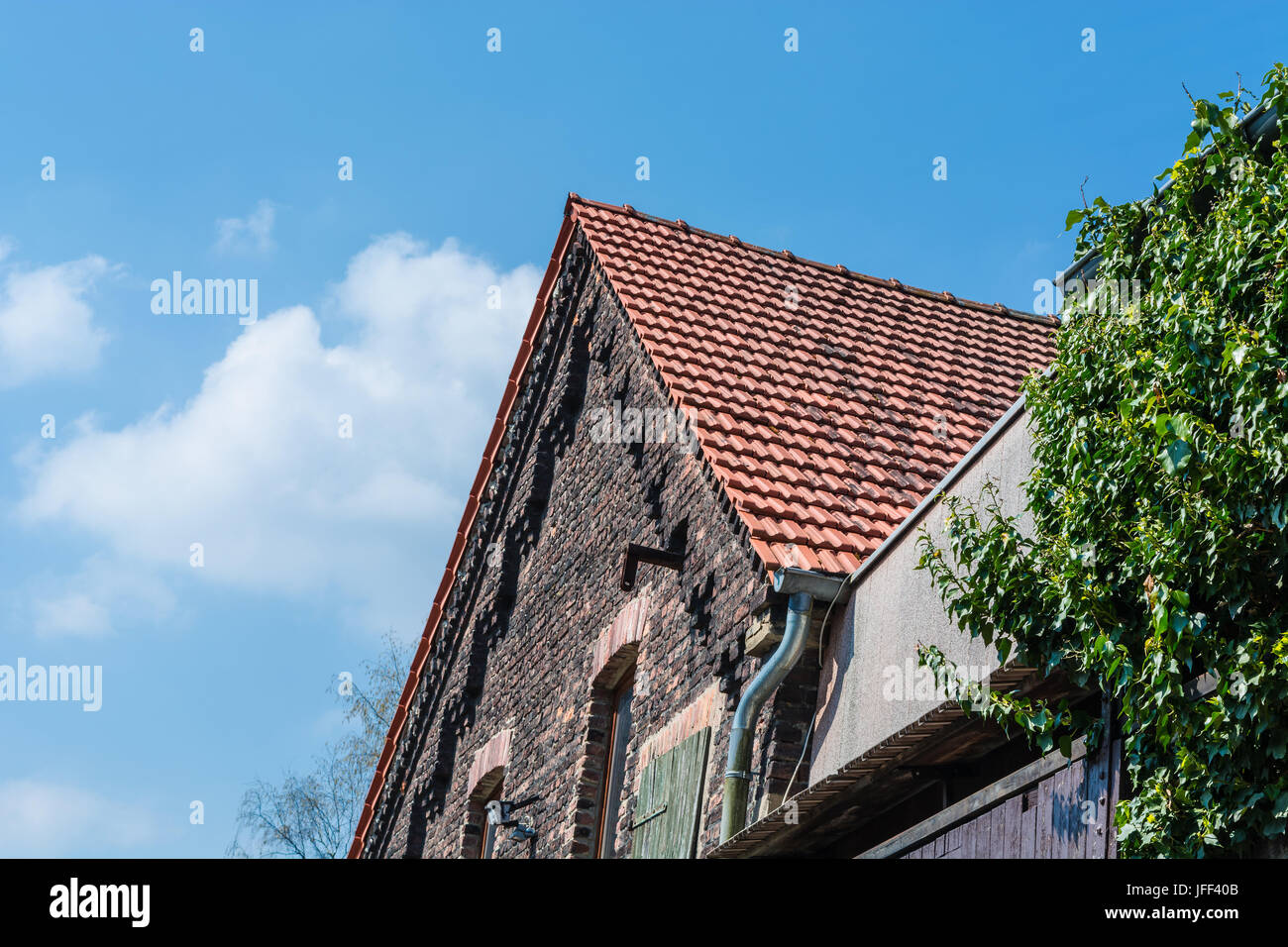 House with stone gable made of brick Stock Photo - Alamy