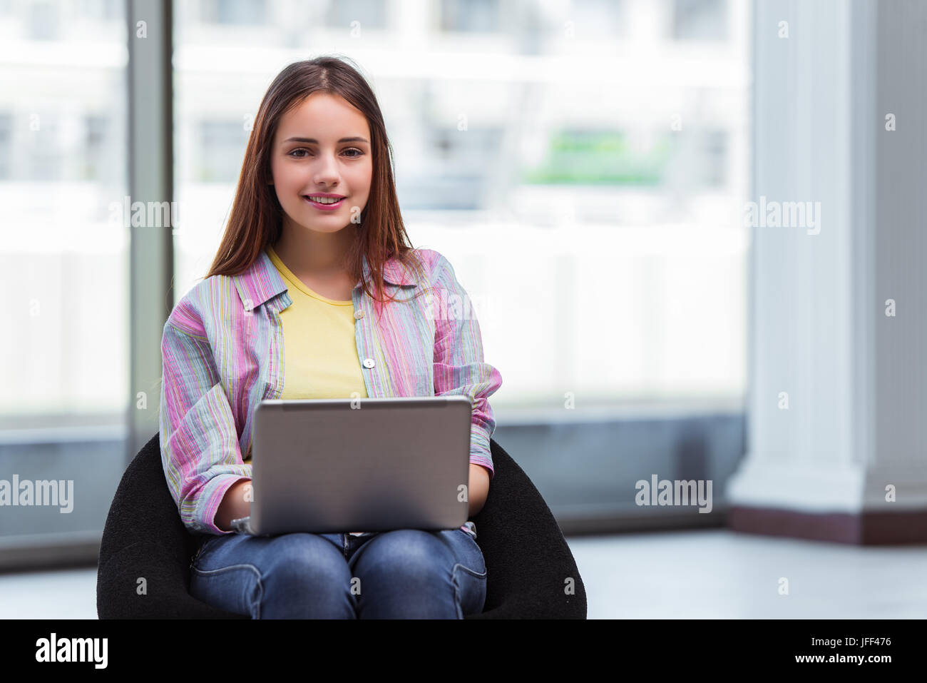 Young girl surfing internet on laptop Stock Photo - Alamy