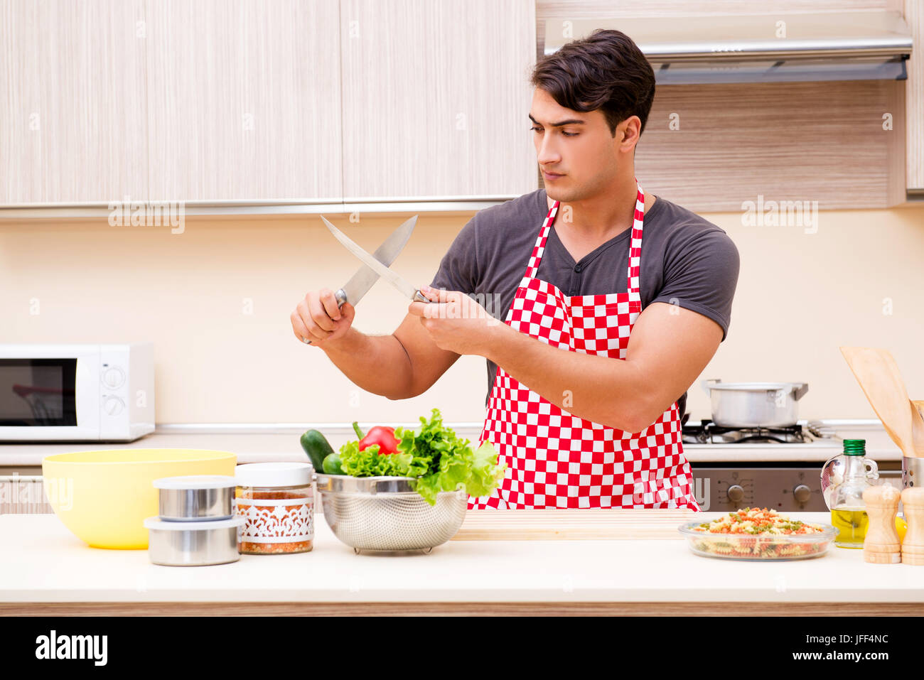 Man male cook preparing food in kitchen Stock Photo - Alamy