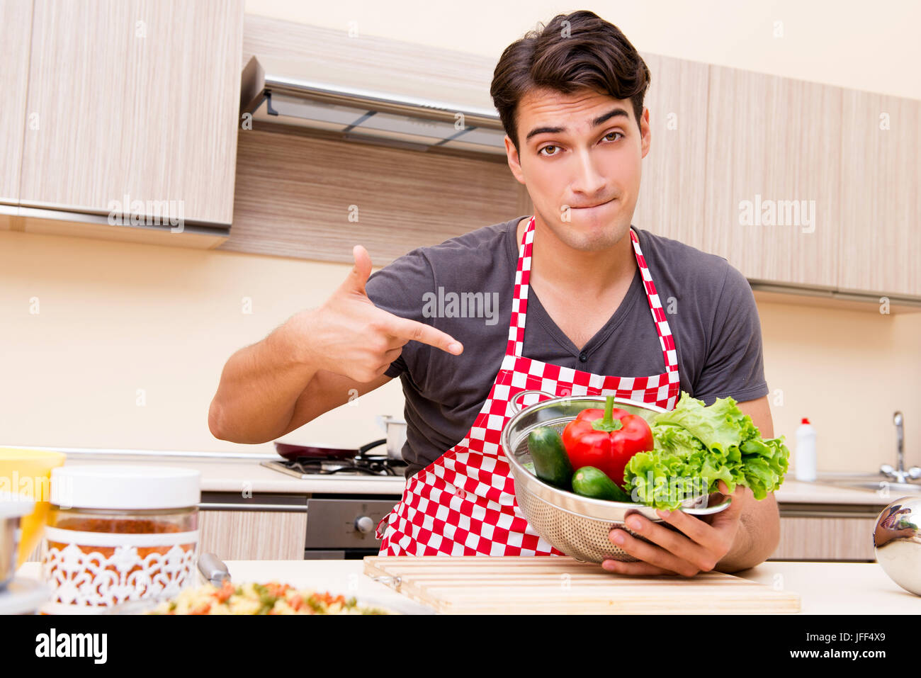 Man male cook preparing food in kitchen Stock Photo - Alamy