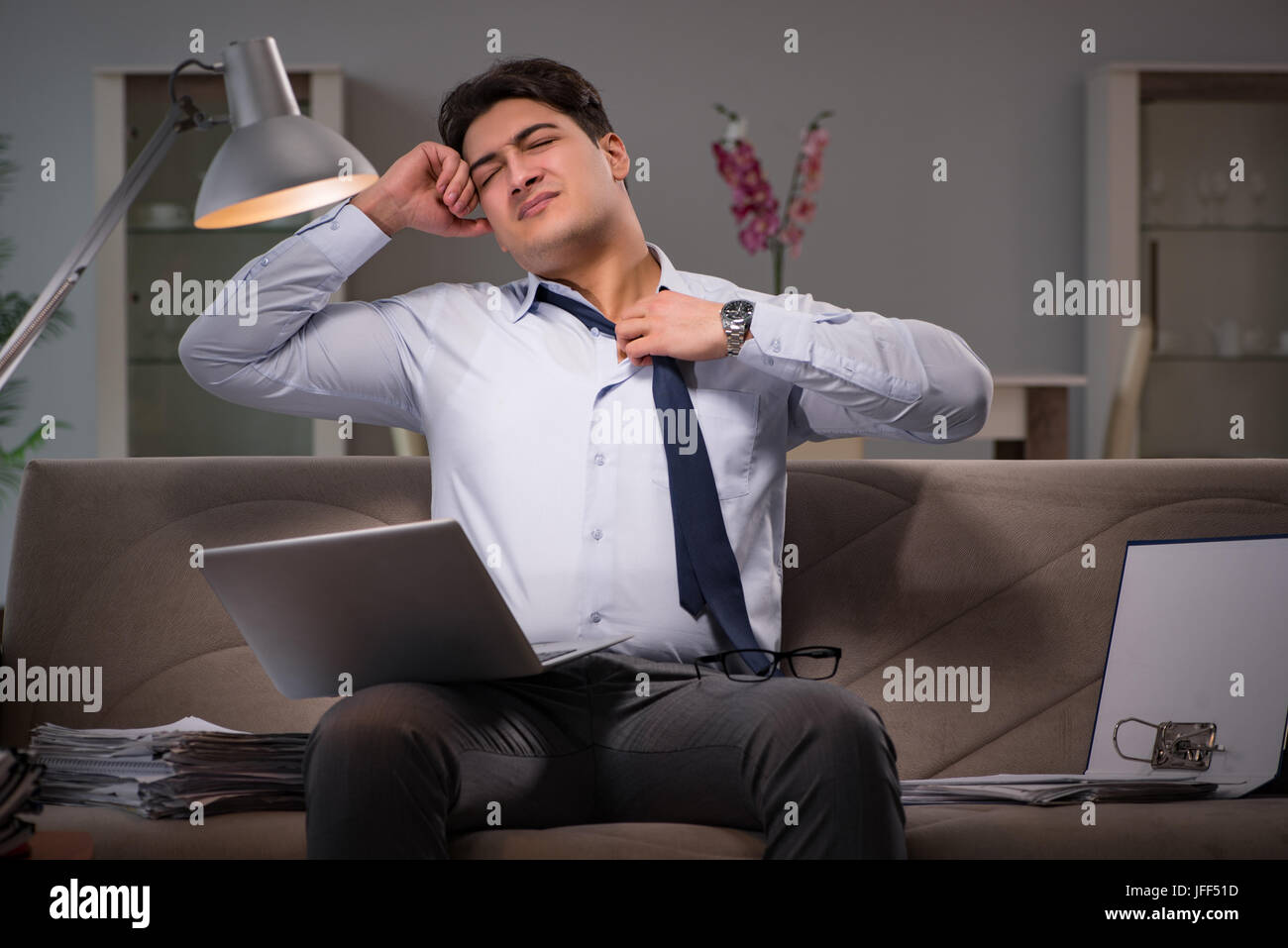 Businessman workaholic working late at home Stock Photo - Alamy