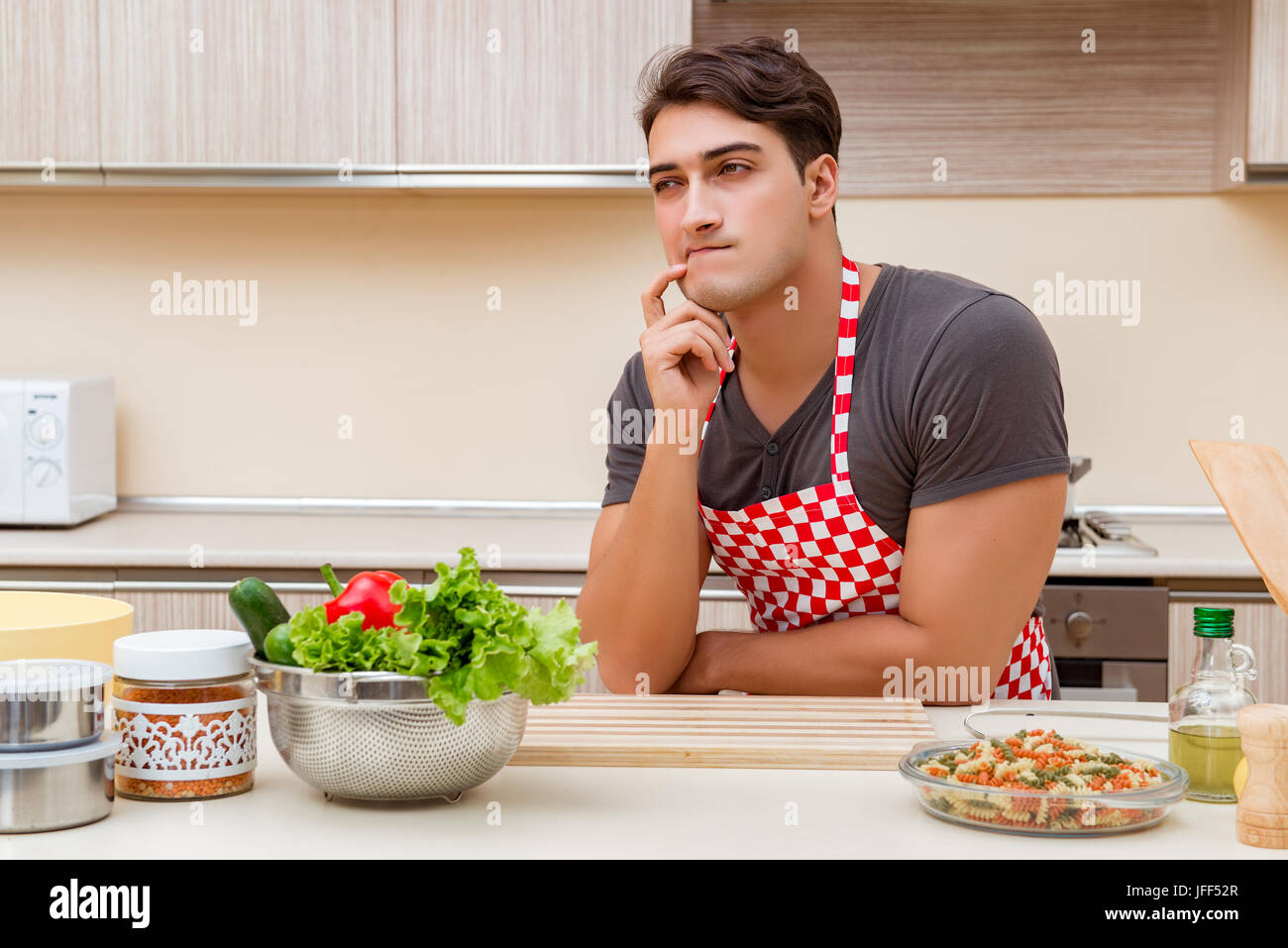 Man male cook preparing food in kitchen Stock Photo - Alamy