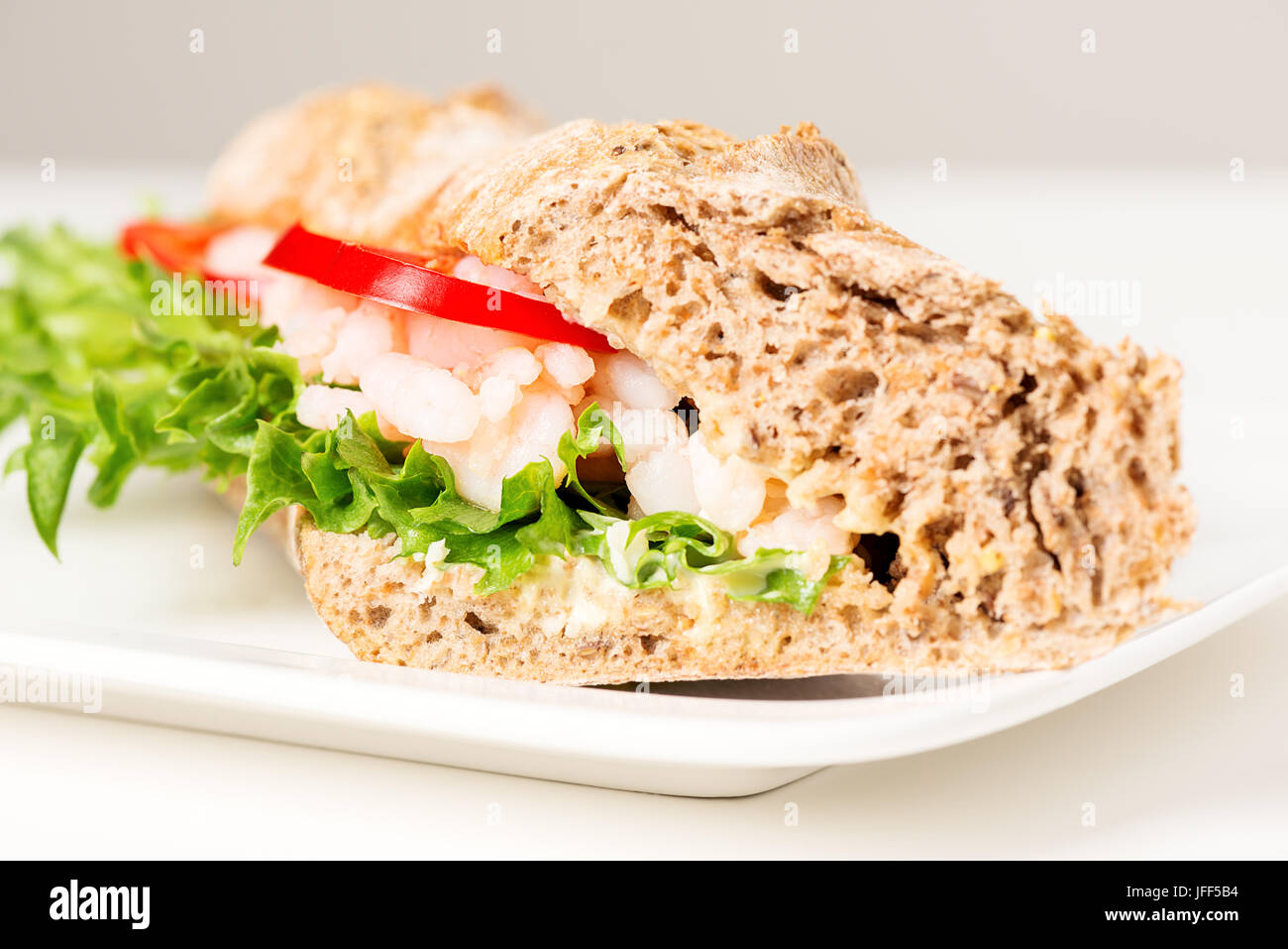 Prawn sandwich on white plate Stock Photo - Alamy