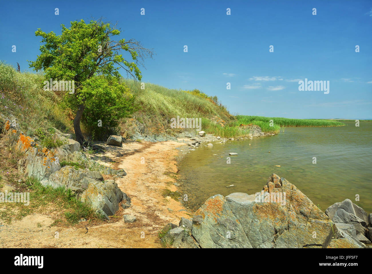 Shore of Lake Sinoe where is standing the ancient ruins of the city of ...