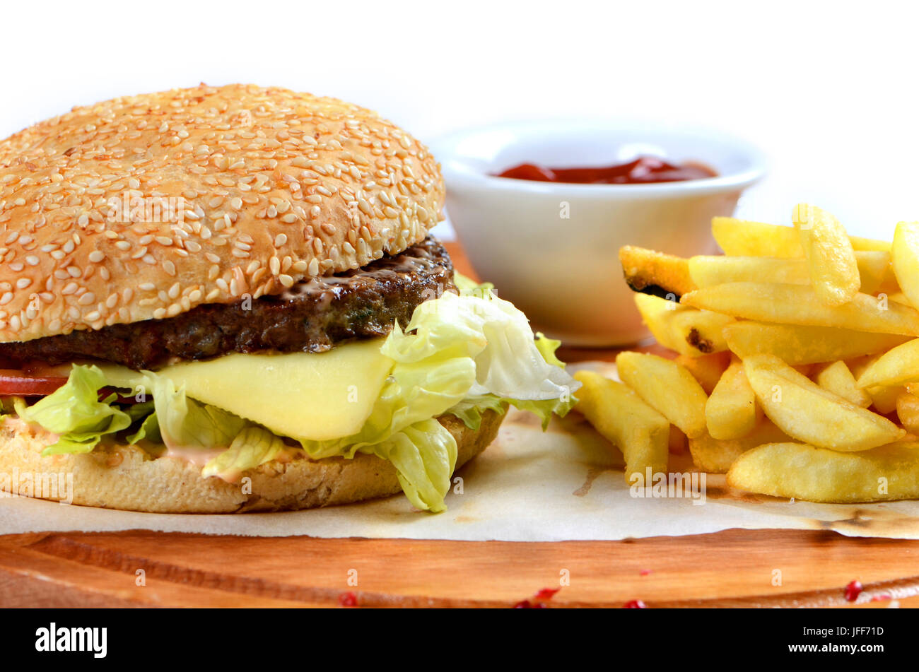 Big burger and chips on the table Stock Photo - Alamy