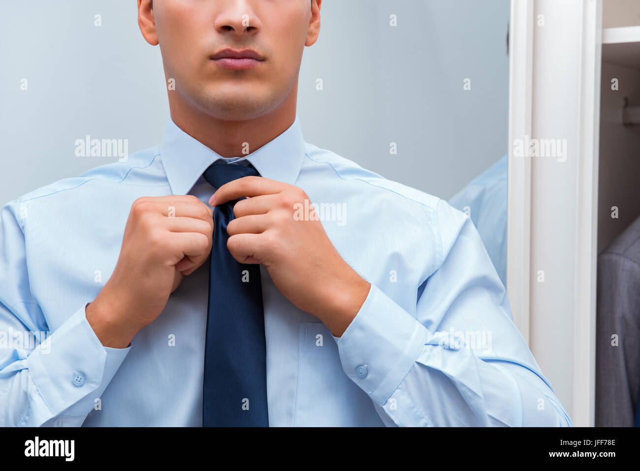 Businessman dressing up for work Stock Photo - Alamy