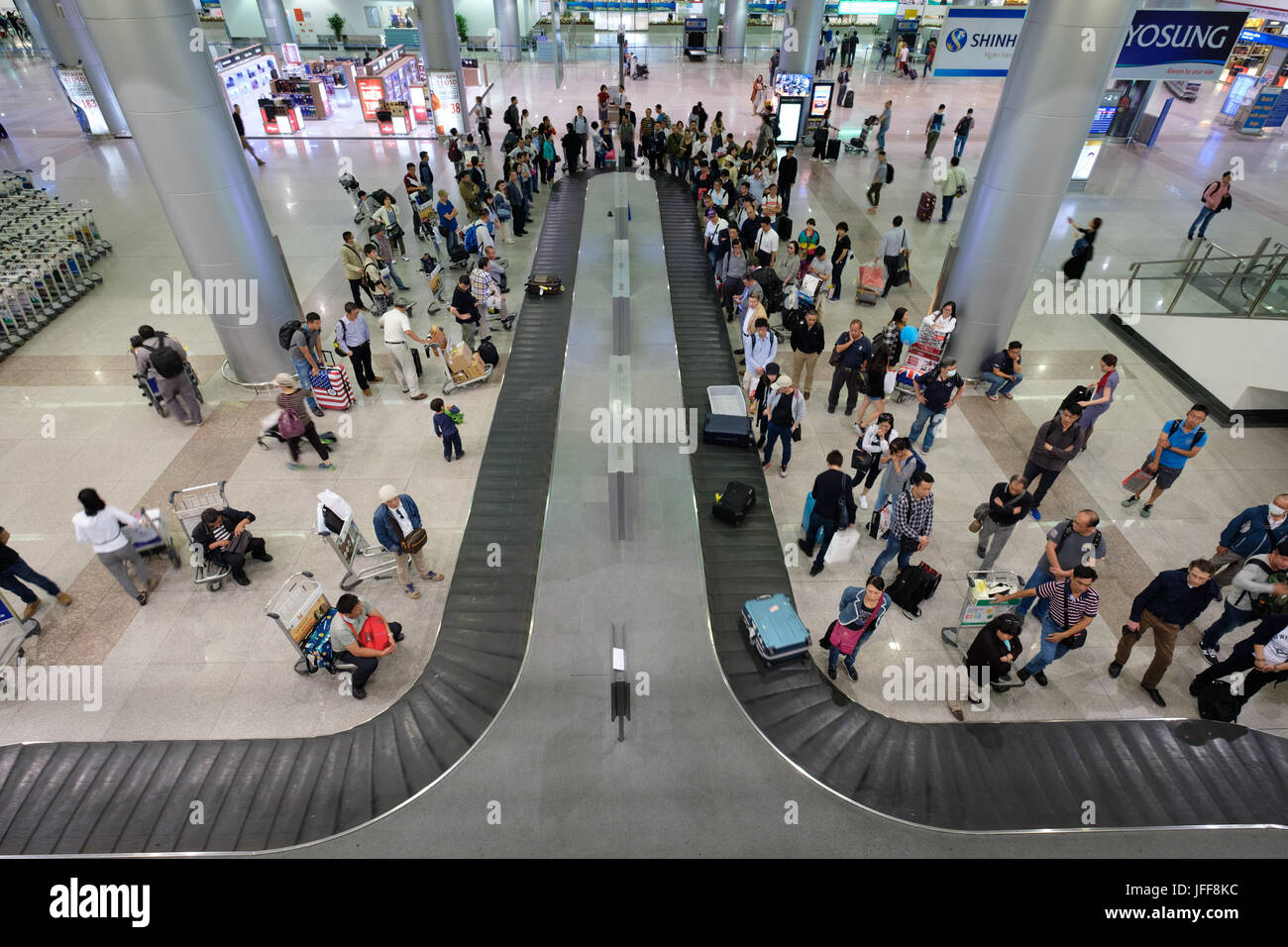Overhead view of the baggage claim area at the arrivals terminal at Tan ...