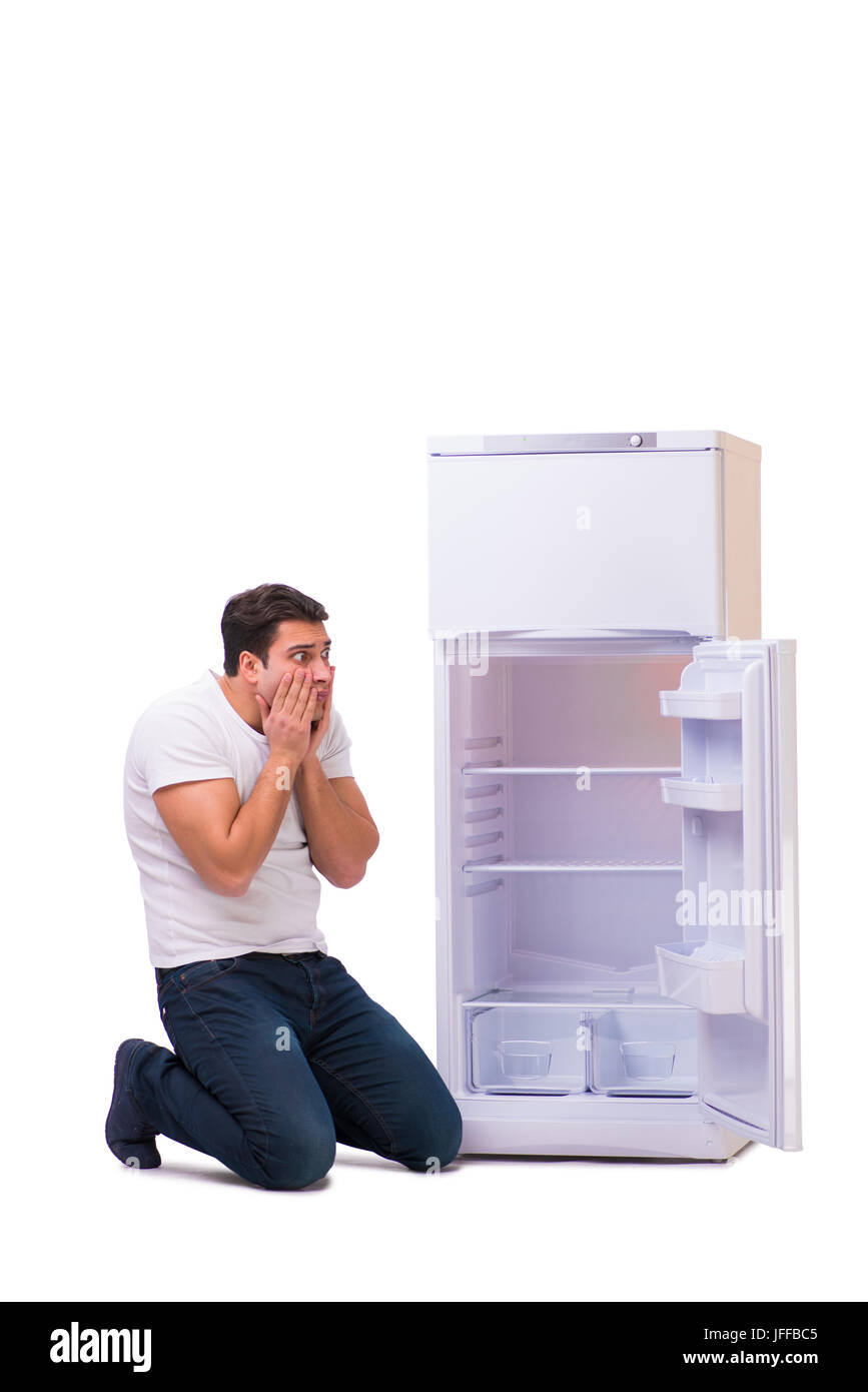 Man looking for food in empty fridge Stock Photo - Alamy